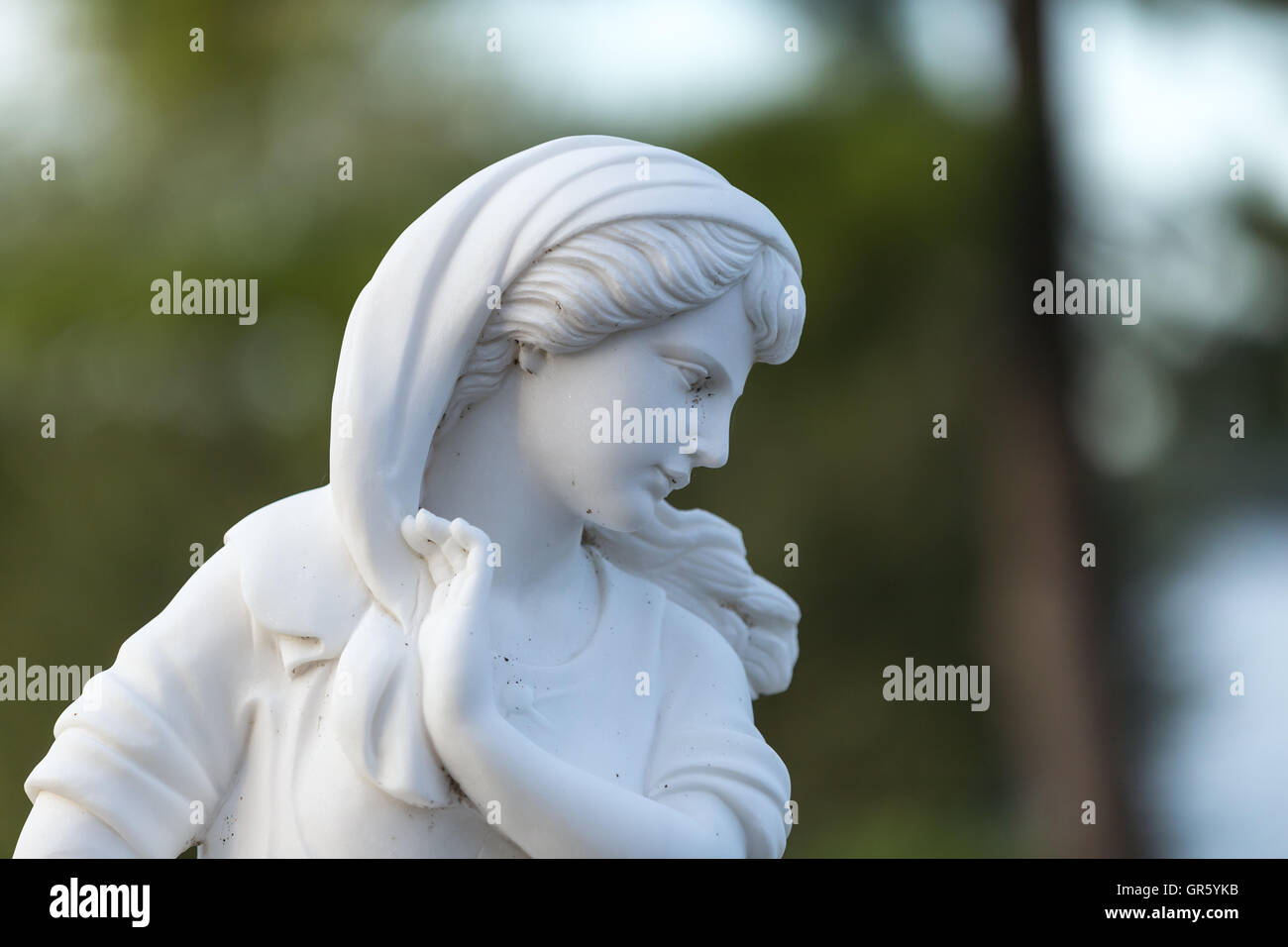 Statue of a beautiful woman in summer Stock Photo - Alamy