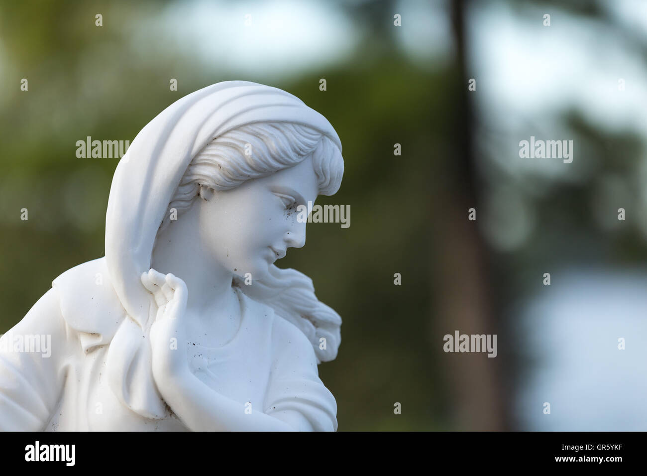 Statue of a beautiful woman in summer Stock Photo - Alamy