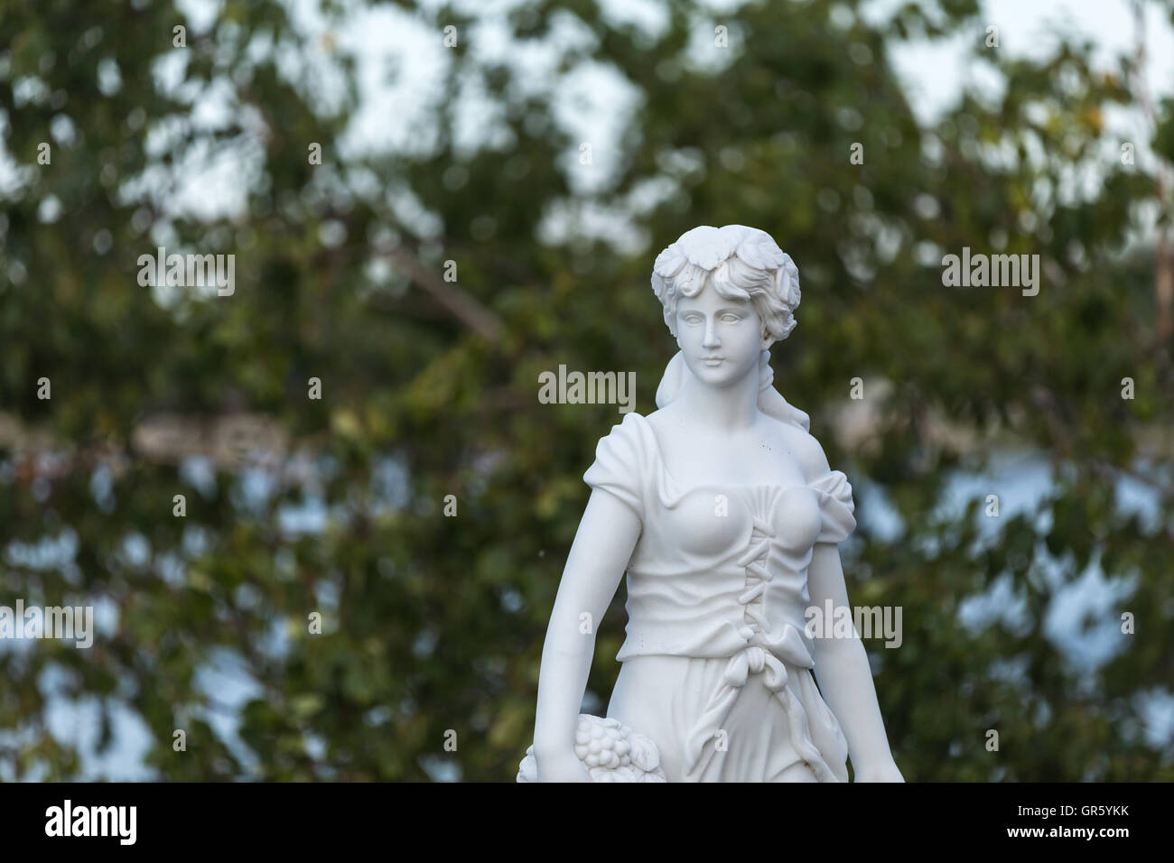 Statue of a beautiful woman in summer Stock Photo - Alamy