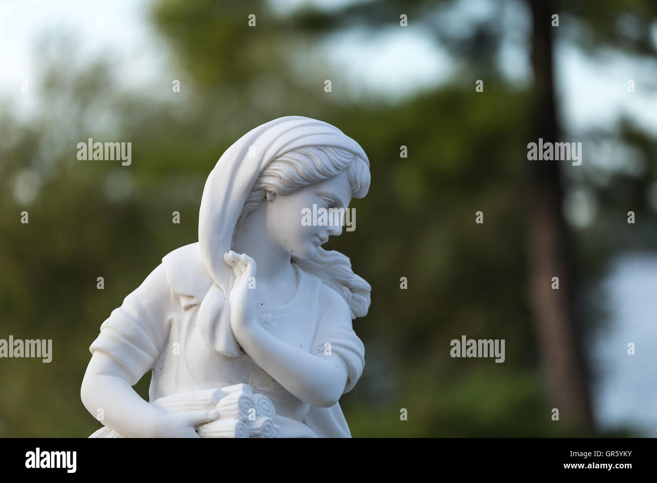 Statue of a beautiful woman in summer Stock Photo - Alamy