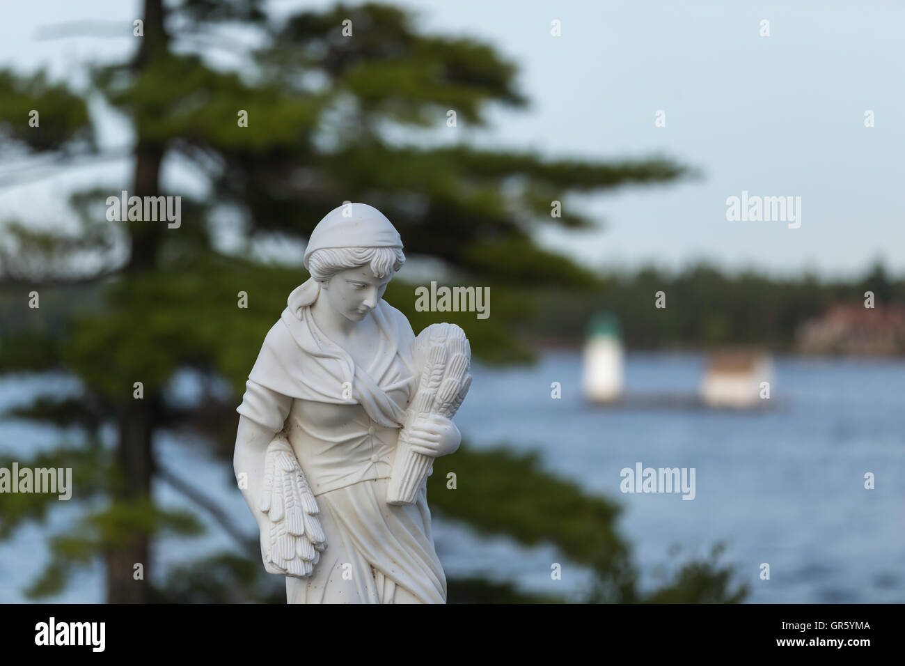 Statue of a beautiful woman in summer Stock Photo - Alamy