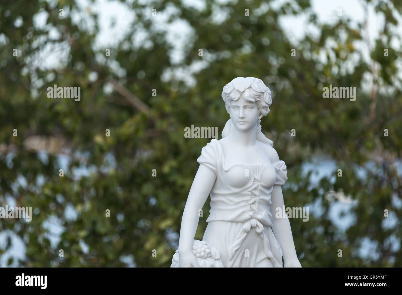 Statue of a beautiful woman in summer Stock Photo - Alamy