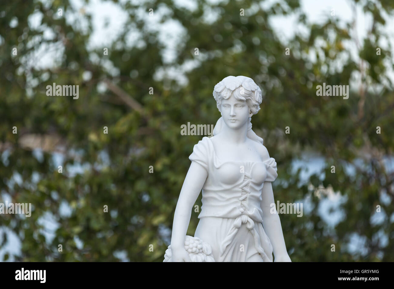 Statue of a beautiful woman in summer Stock Photo - Alamy
