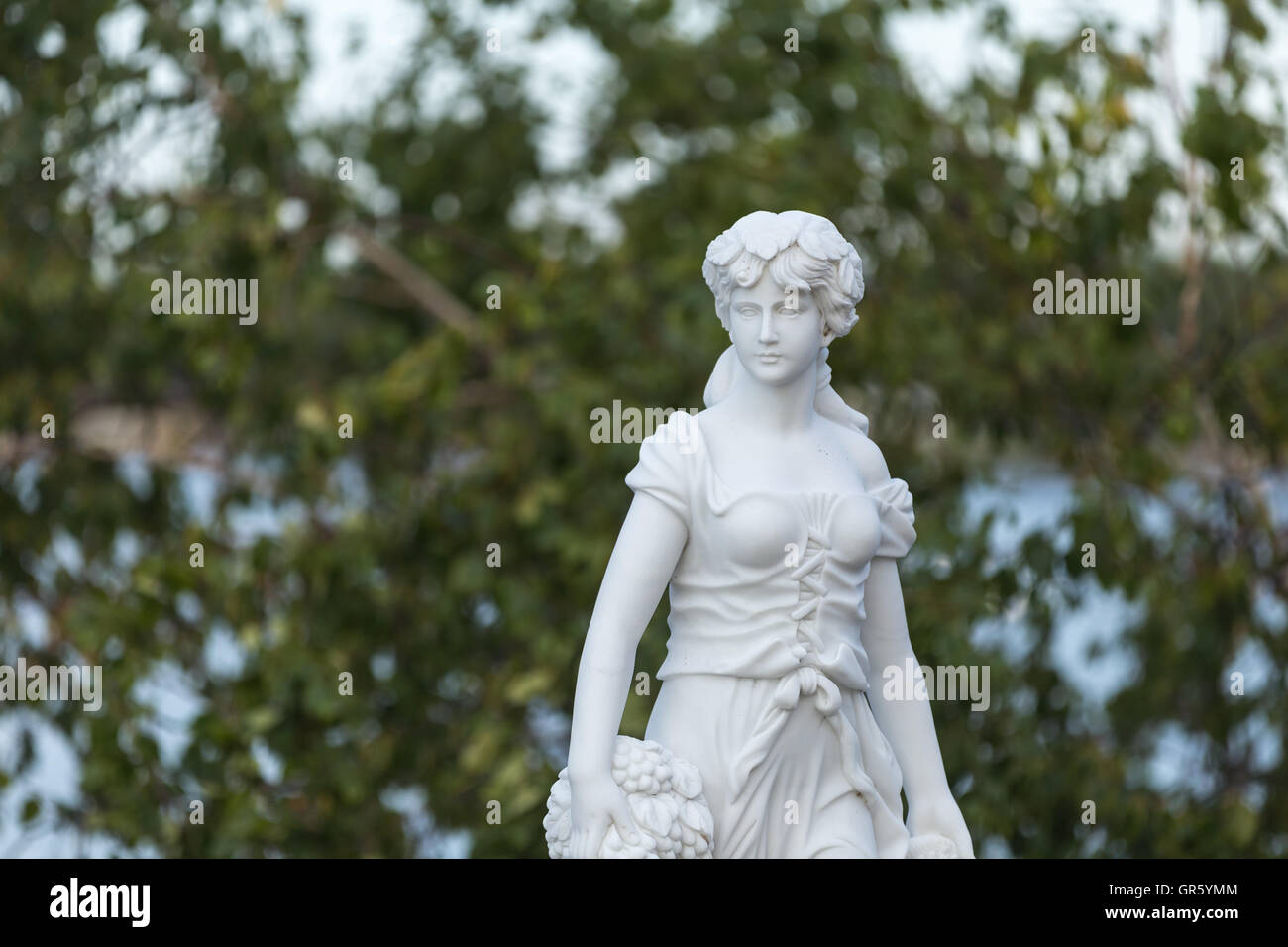 Statue of a beautiful woman in summer Stock Photo - Alamy