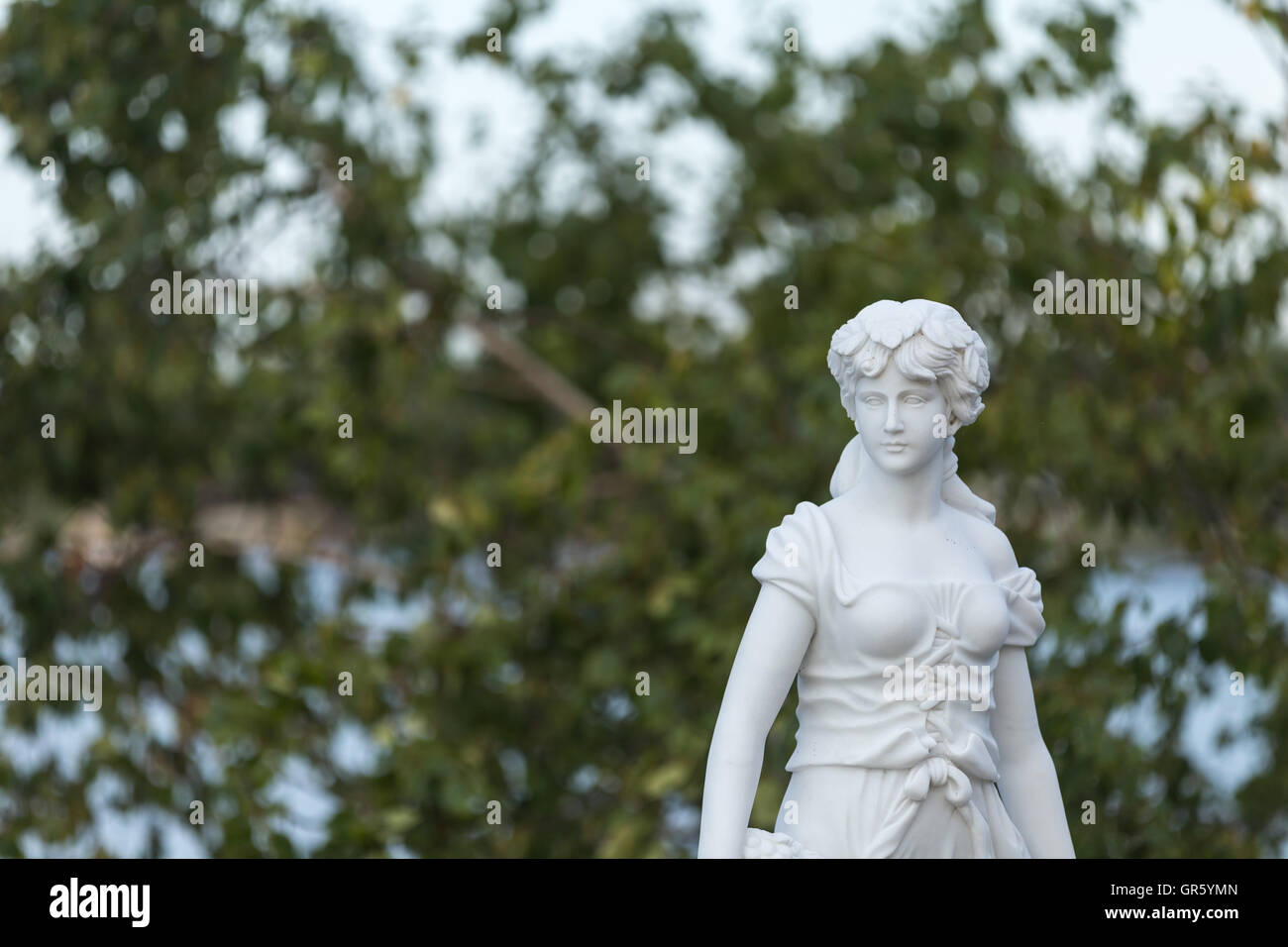Statue of a beautiful woman in summer Stock Photo - Alamy