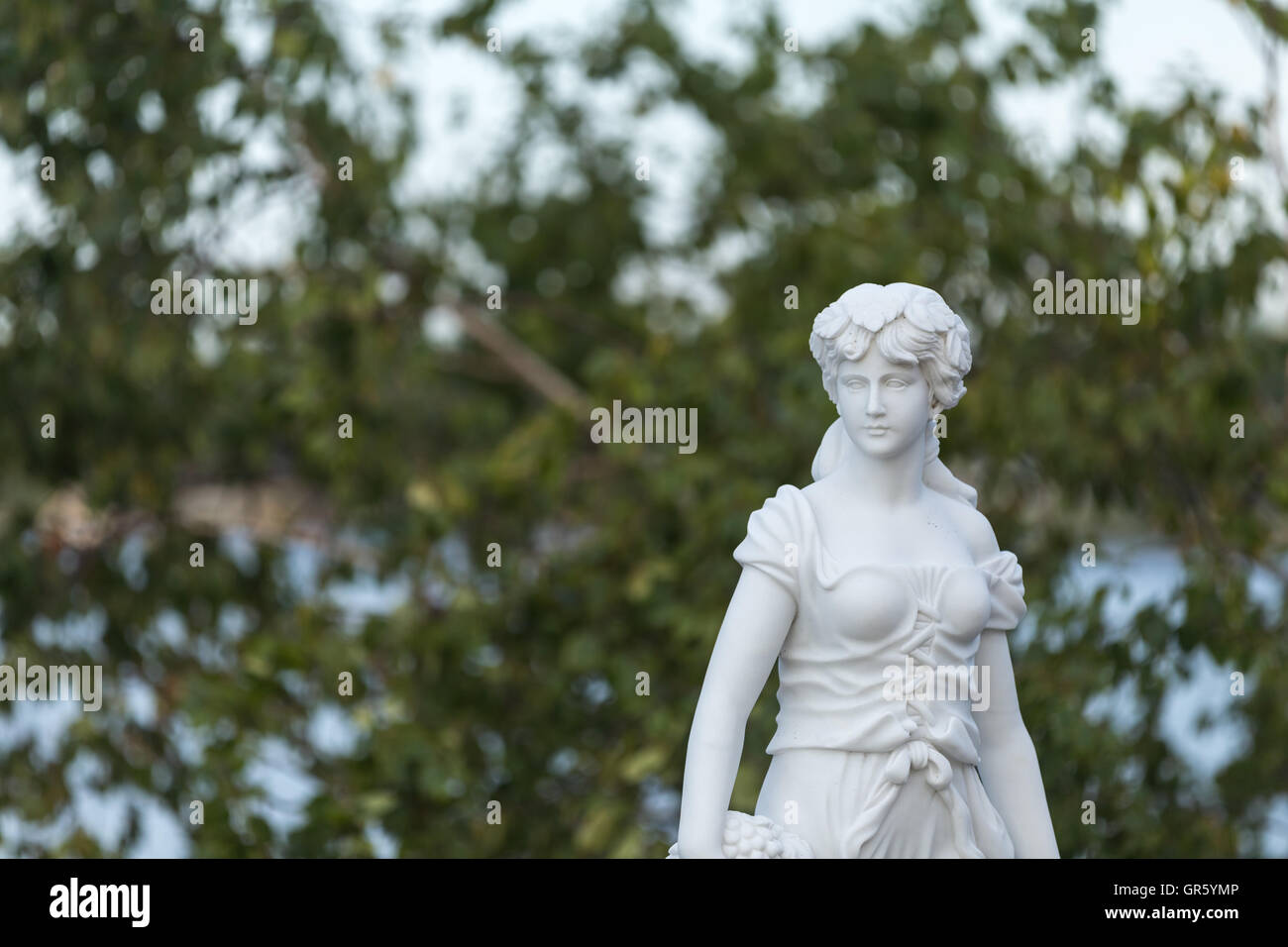 Statue of a beautiful woman in summer Stock Photo - Alamy
