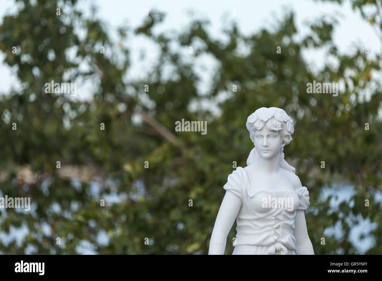 Statue of a beautiful woman in summer Stock Photo - Alamy