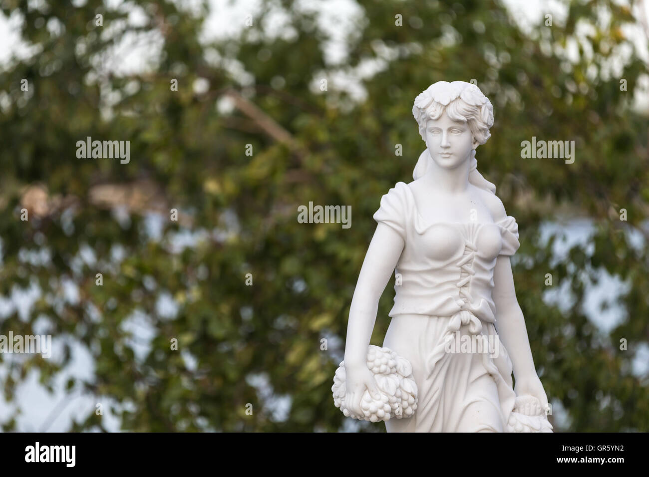 Statue of a beautiful woman in summer Stock Photo - Alamy