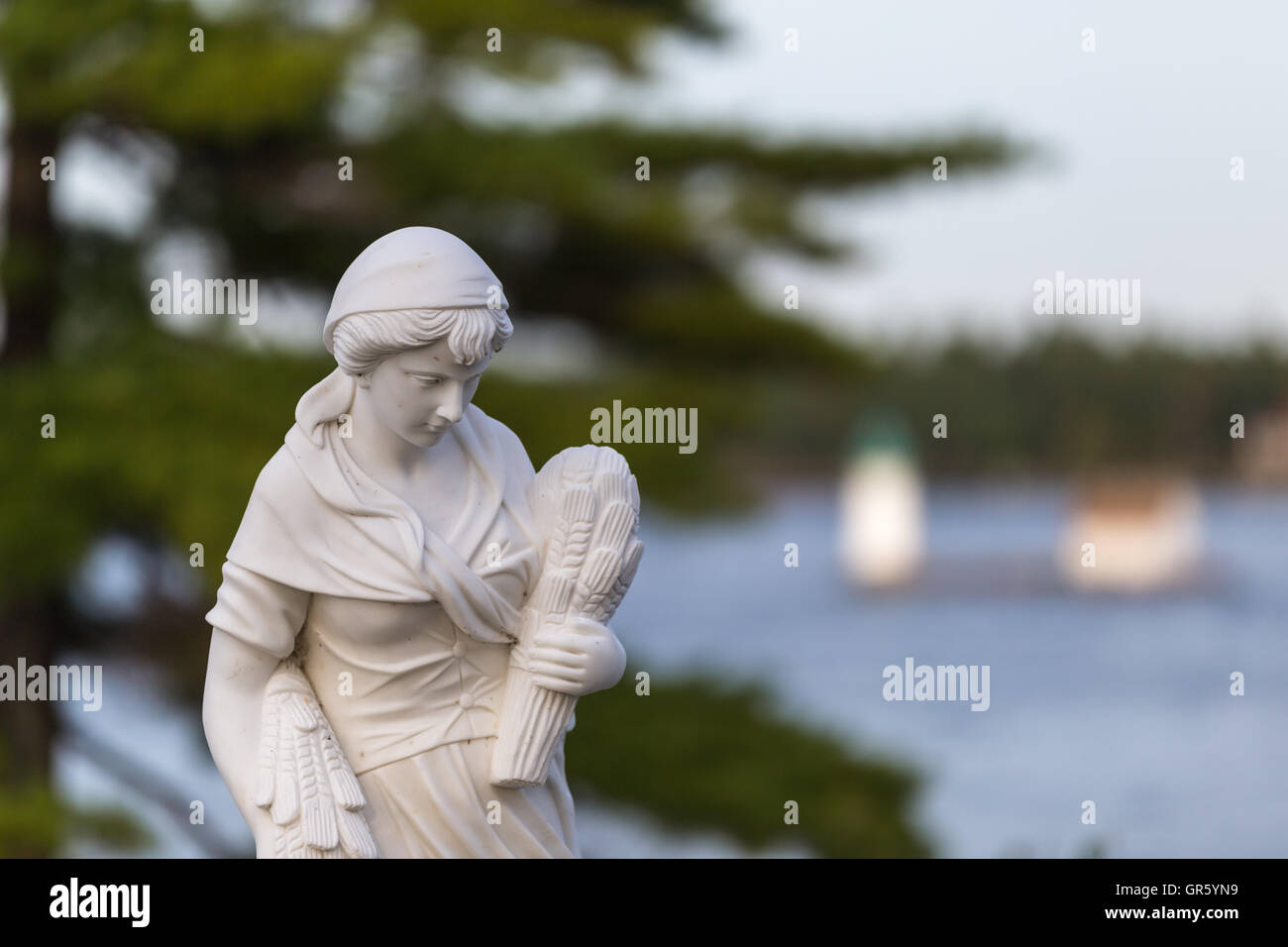 Statue of a beautiful woman in summer Stock Photo - Alamy
