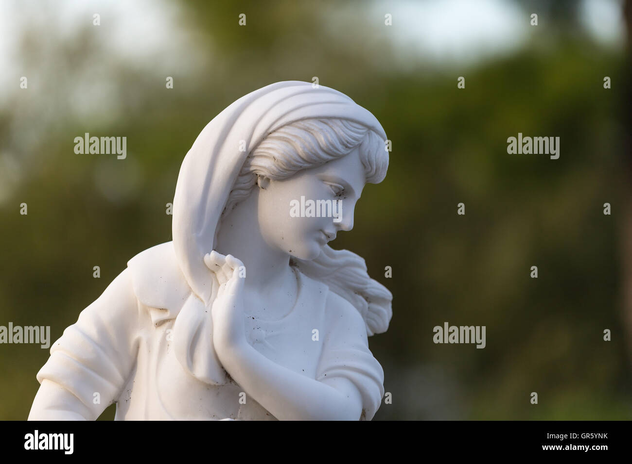 Statue of a beautiful woman in summer Stock Photo - Alamy