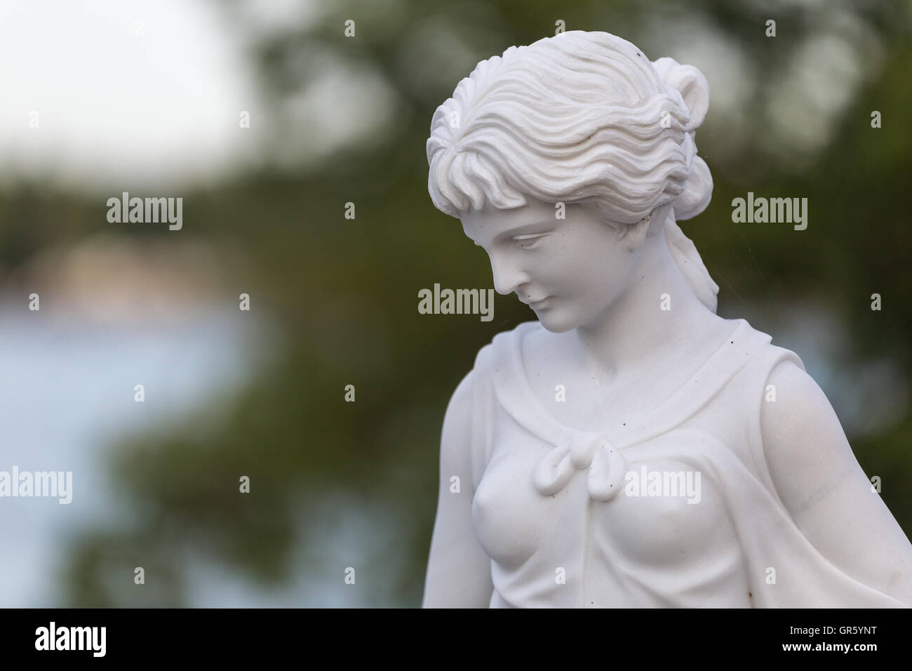 Statue of a beautiful woman in summer Stock Photo - Alamy