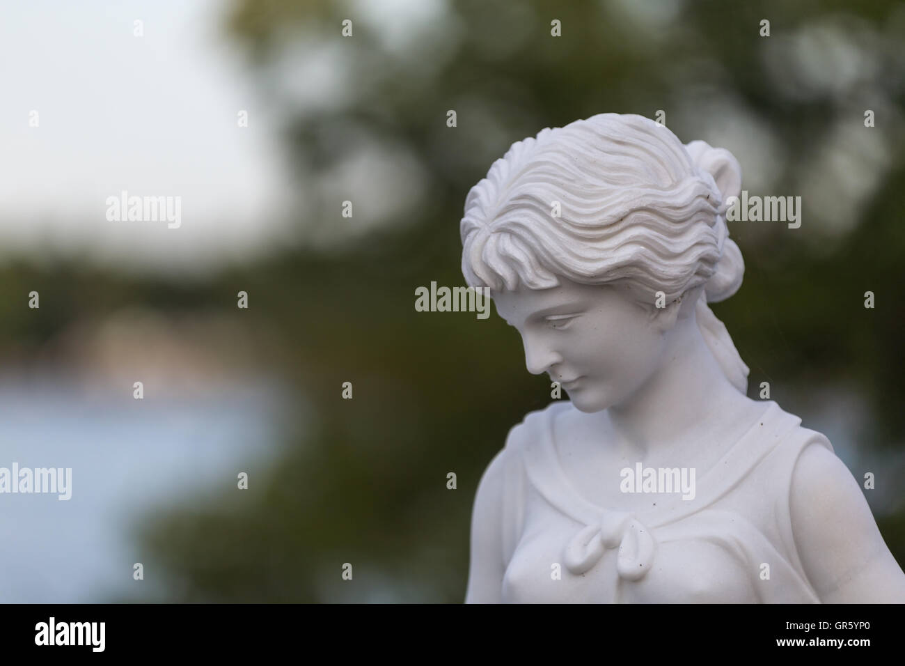 Statue of a beautiful woman in summer Stock Photo - Alamy
