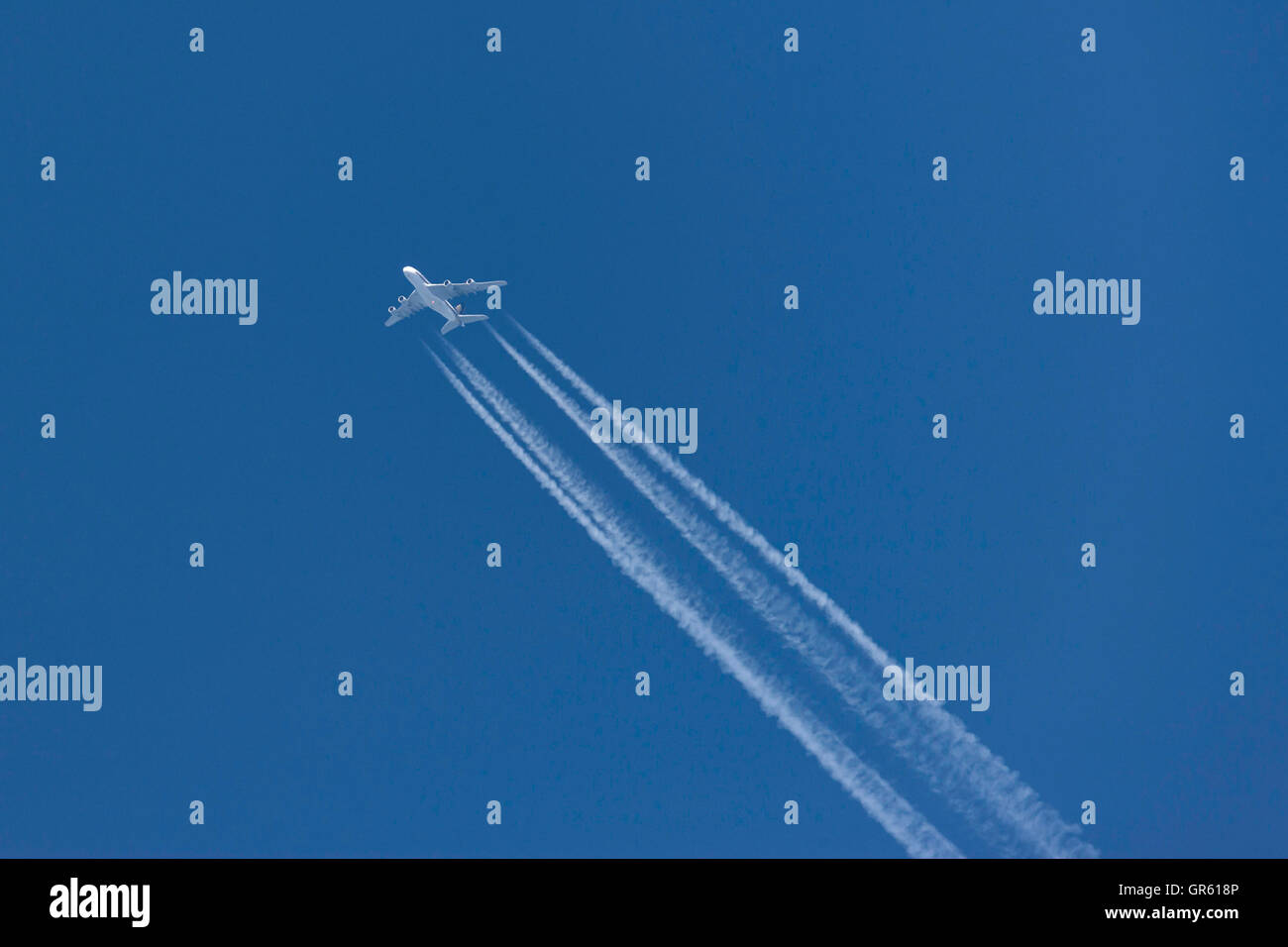 Singapore Airlines Airbus A380 flying at high altitude with a long whit ...