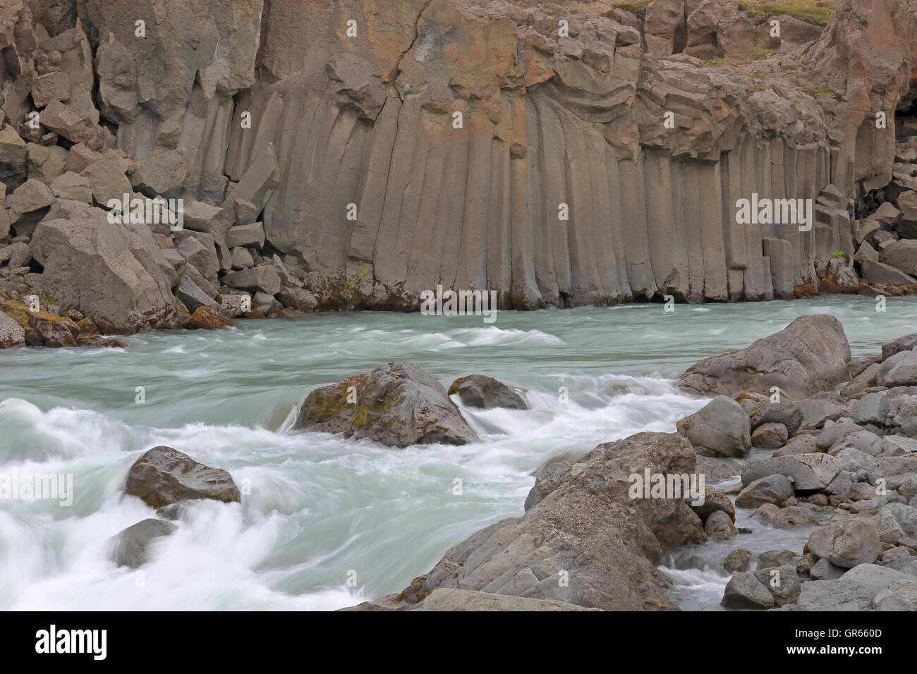 Basalt columns at the side of a river in Iceland Stock Photo - Alamy