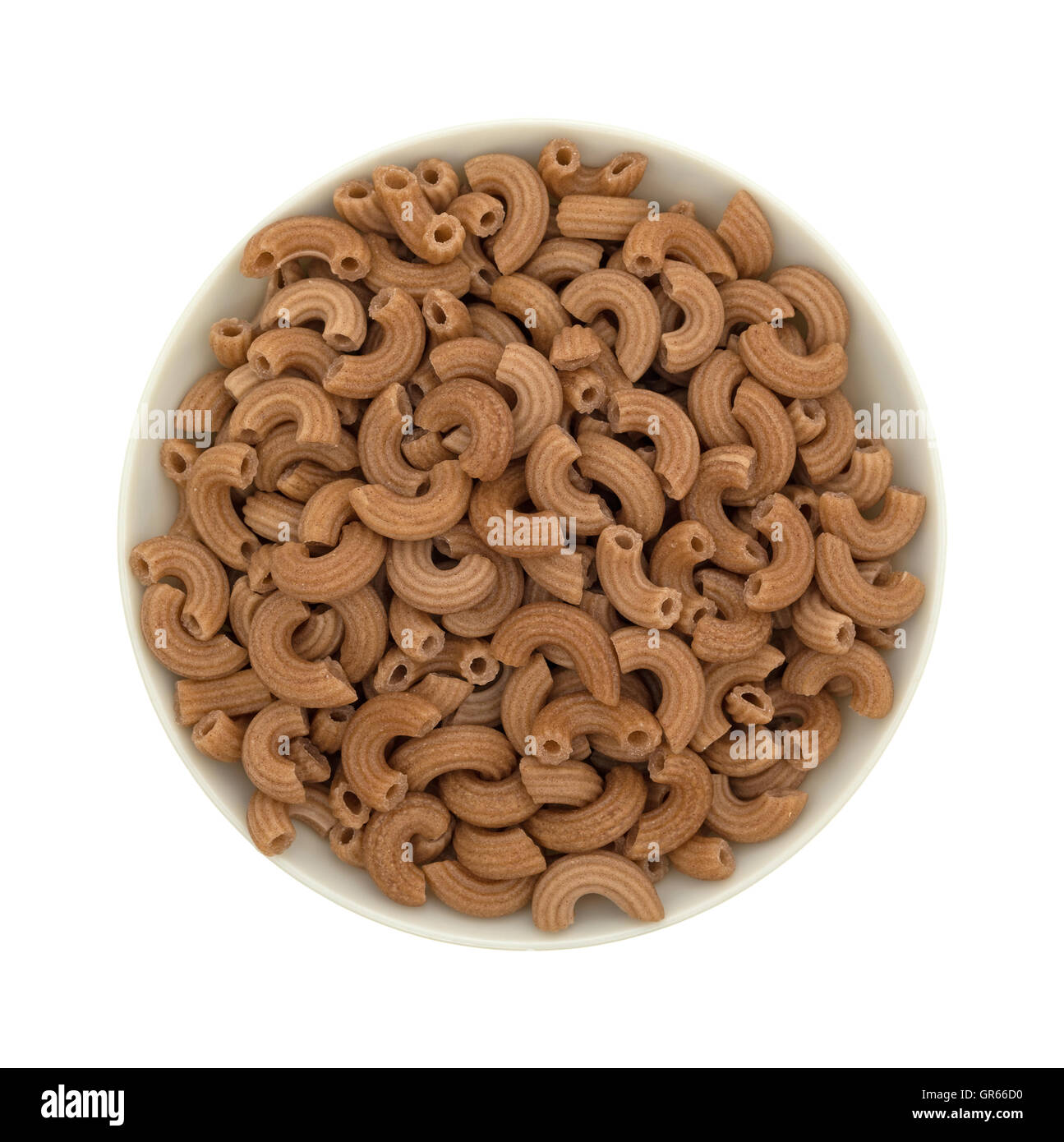 Top view of red rice elbow shaped pasta in a round bowl isolated on a ...