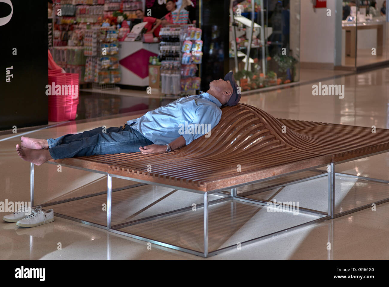 People sleeping in a mall hi-res stock photography and images - Alamy