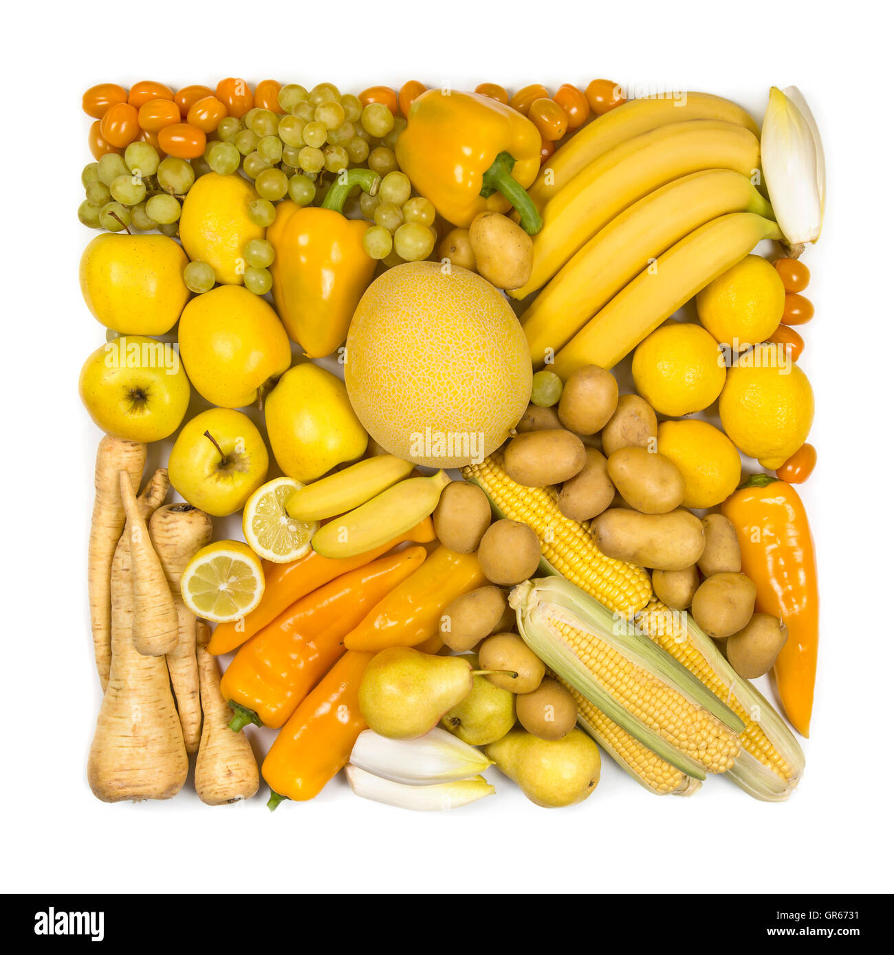 Square of yellow fruits and vegetables isolated on a white background ...