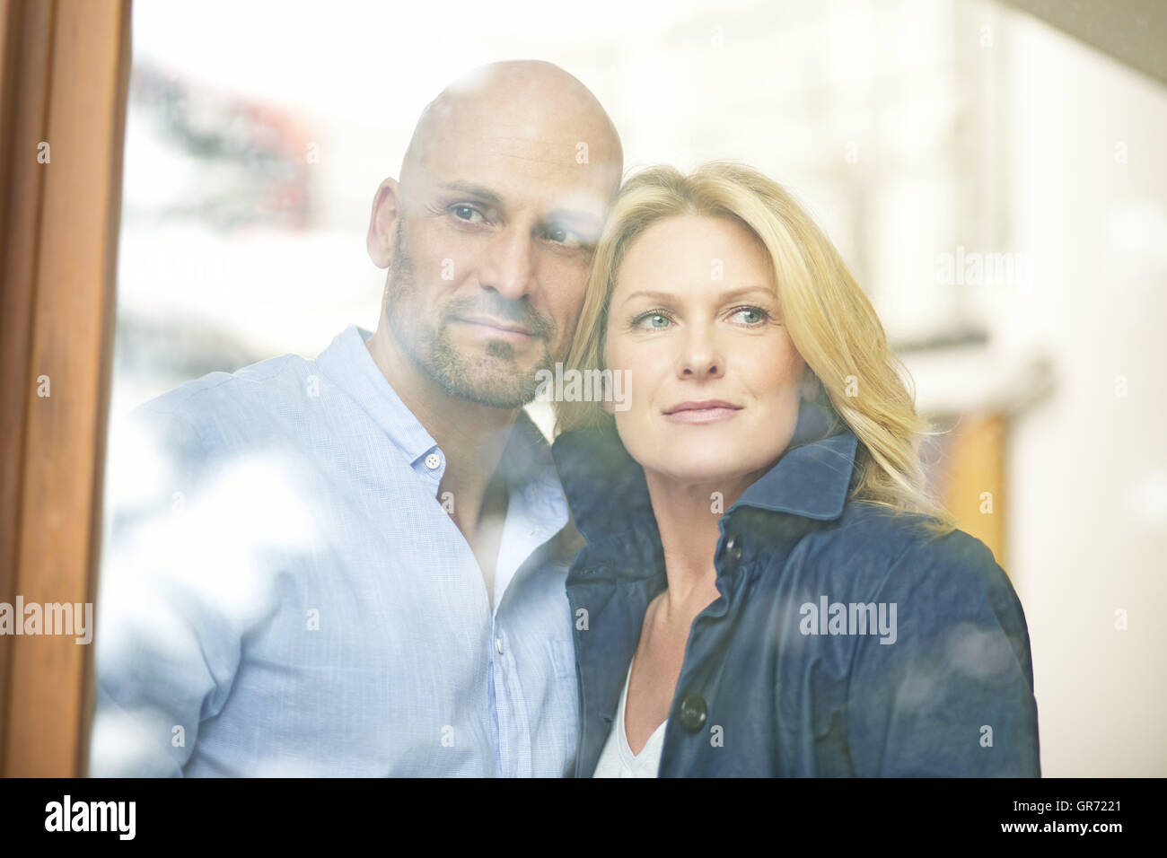 Couple At Window Stock Photo - Alamy