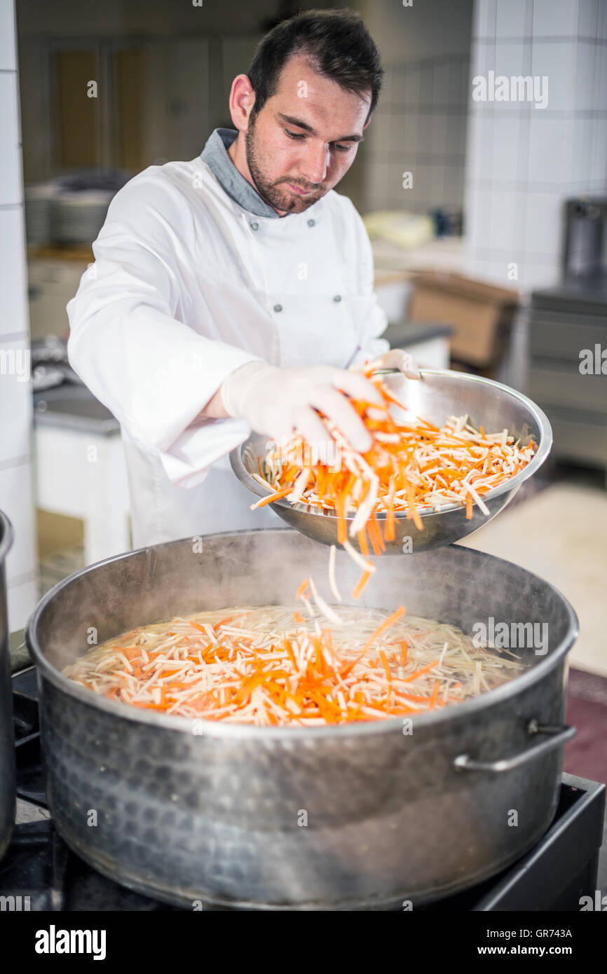 Chef at work, cooking vegetable for soup Stock Photo - Alamy