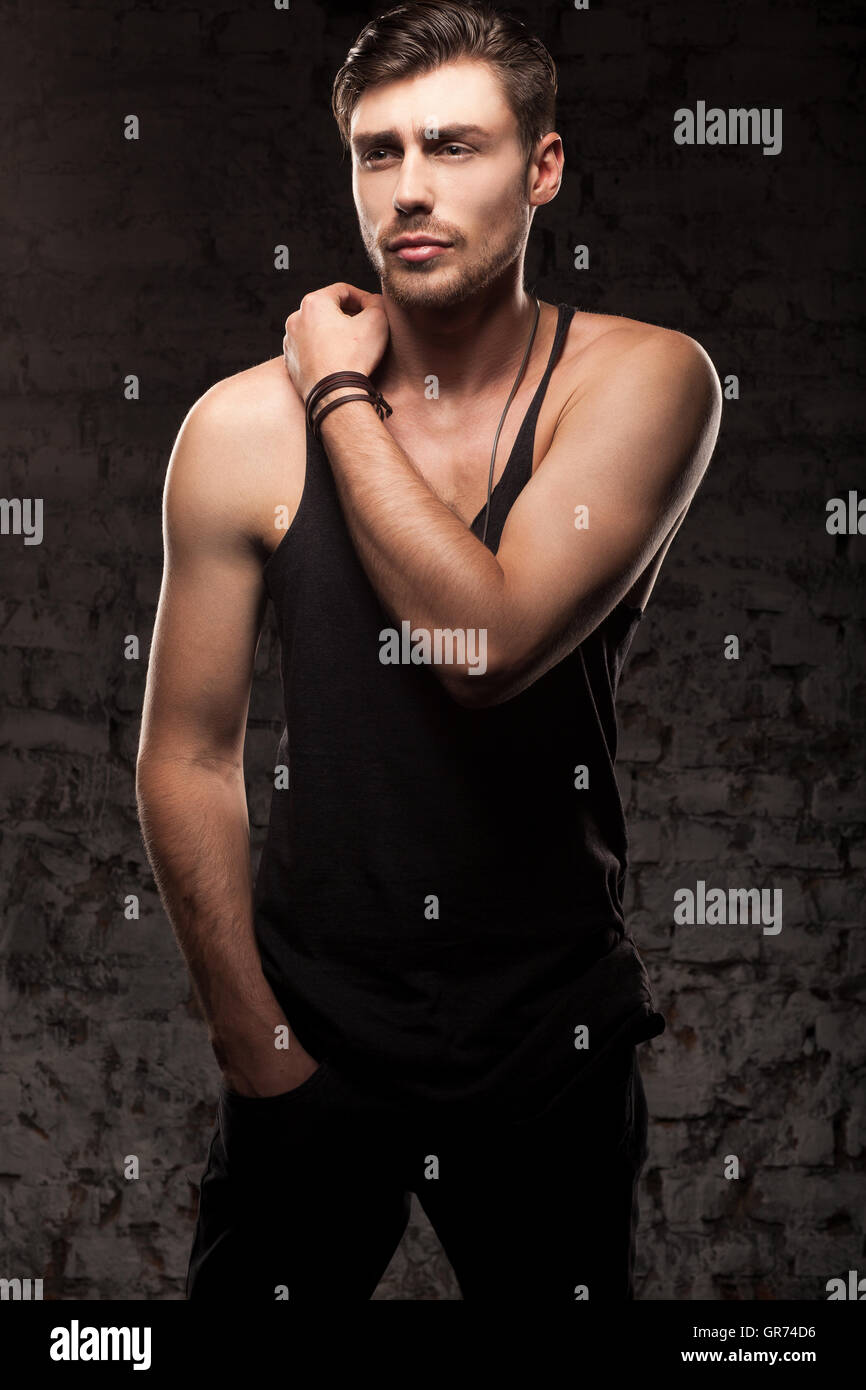 handsome white young muscular man on black background Stock Photo - Alamy