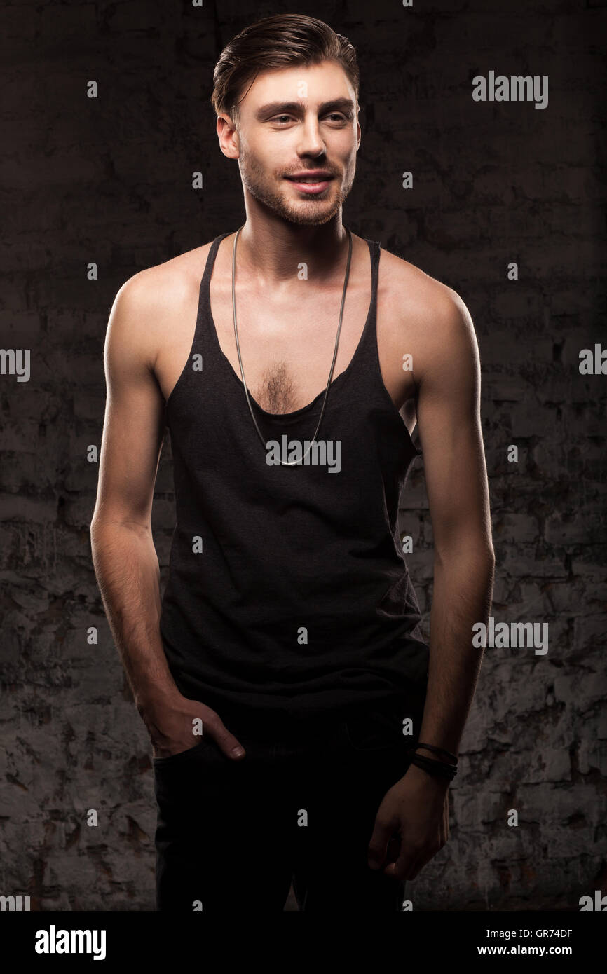 handsome muscular white young man isolated on black background Stock ...