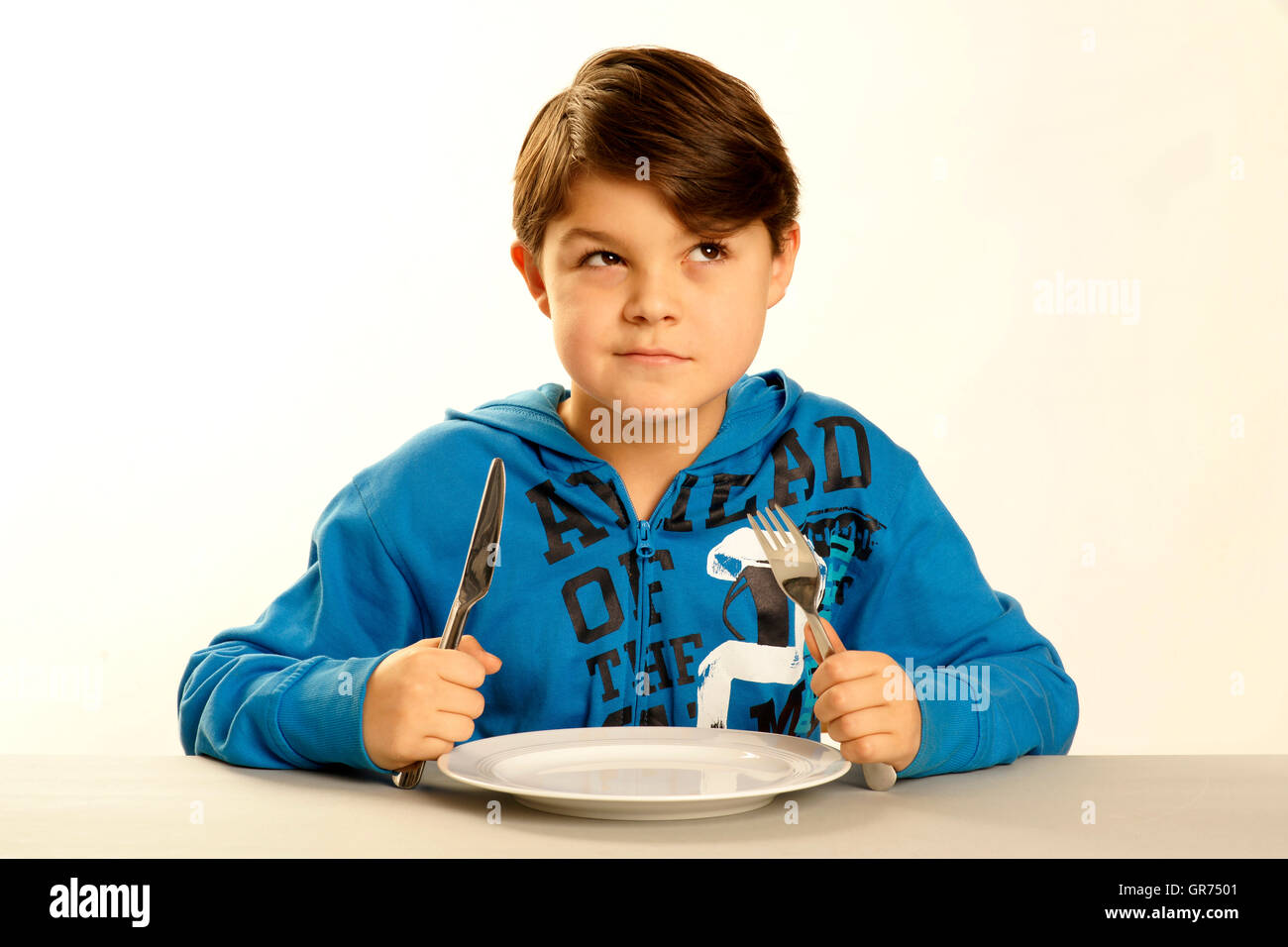 Child With A Empty Plate Stock Photo - Alamy
