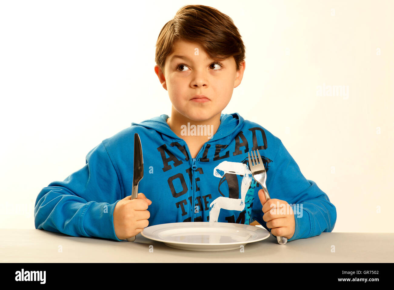 Child With A Empty Plate Stock Photo - Alamy