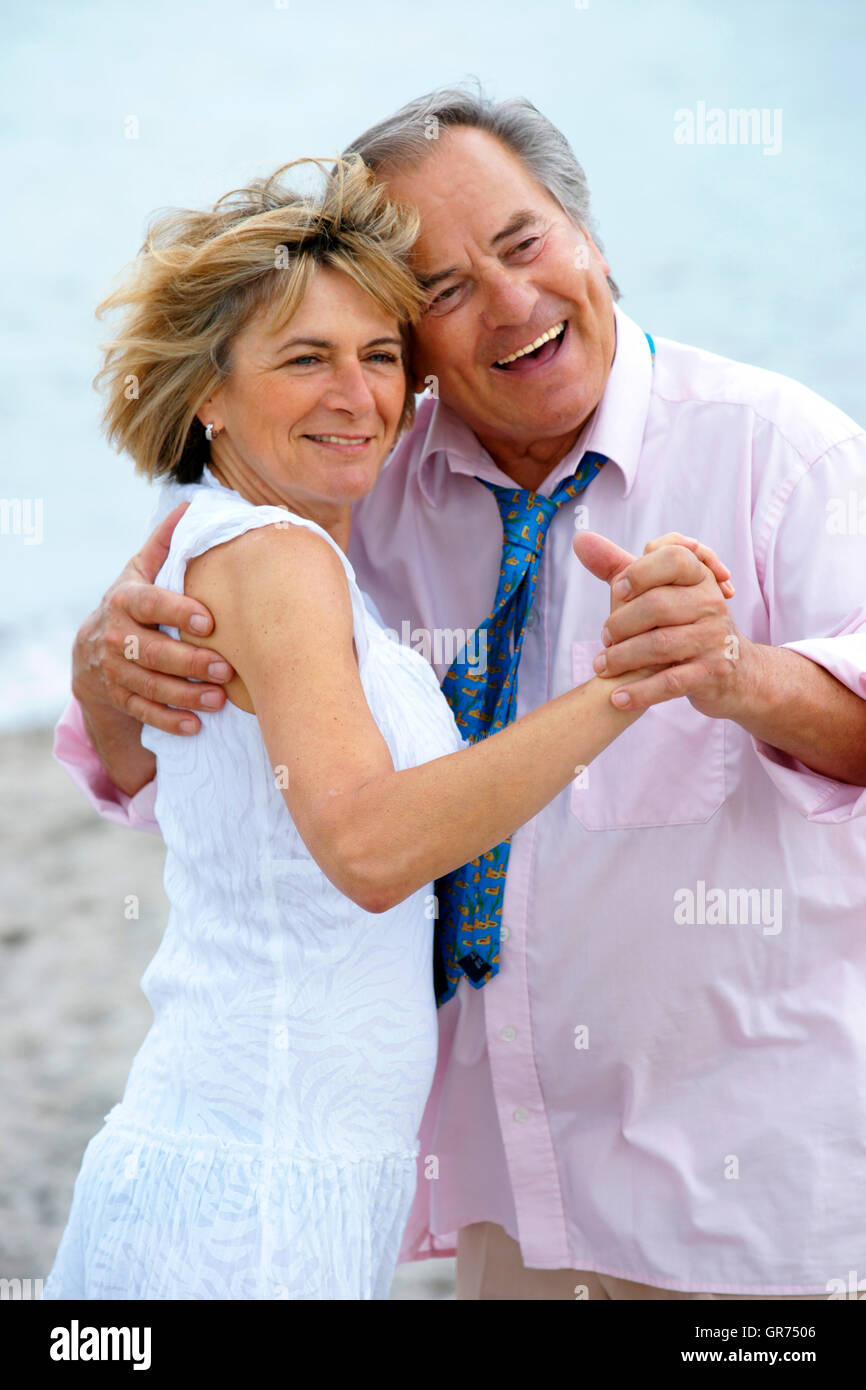 Old Couple Dance On The Beach Stock Photo - Alamy