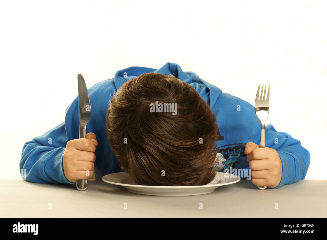 Boy With Plate Stock Photo - Alamy