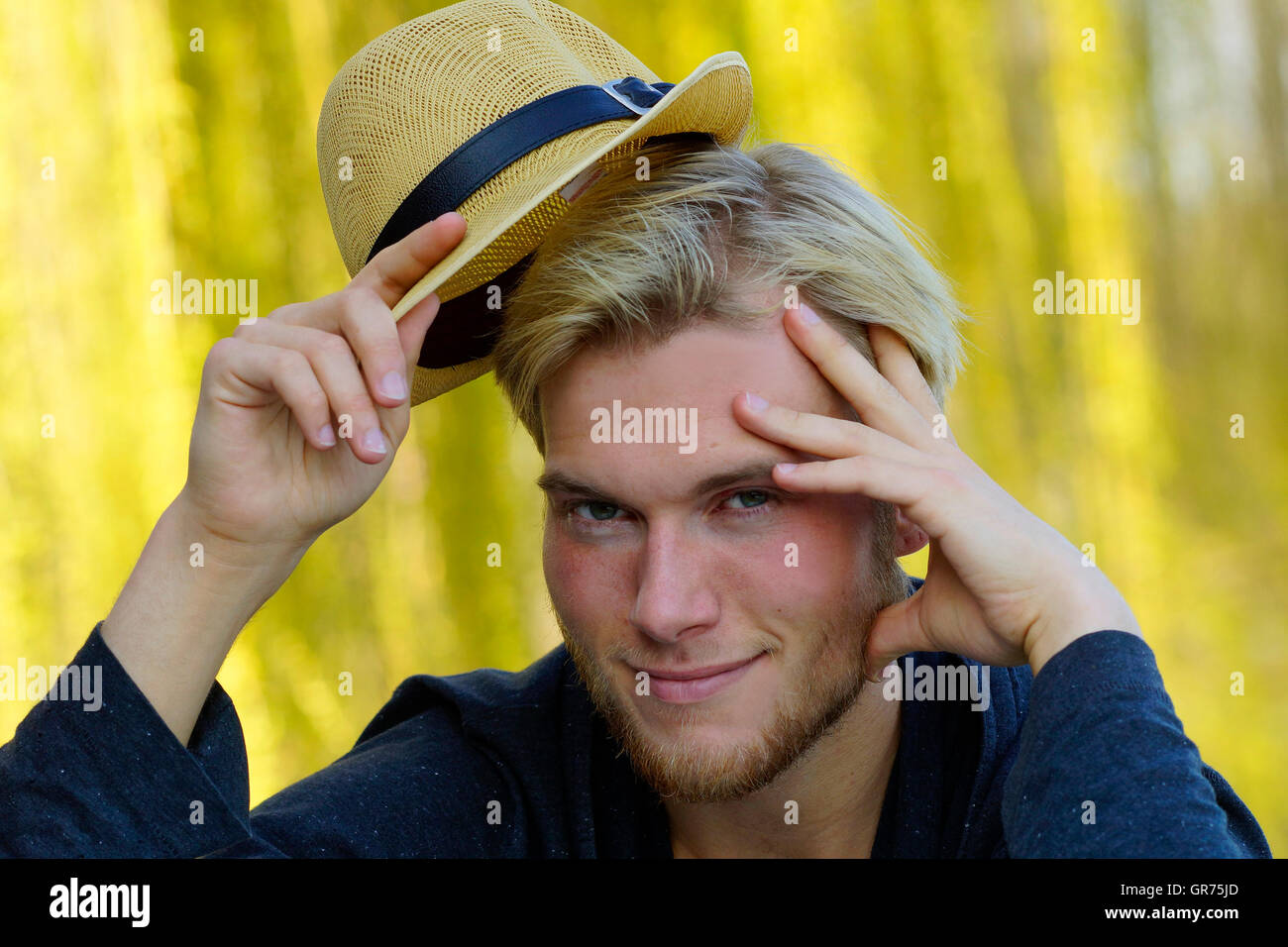 Young Man With Hat Stock Photo - Alamy