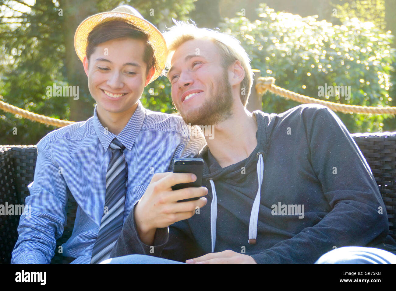 Two Friends With Smartphone Stock Photo - Alamy