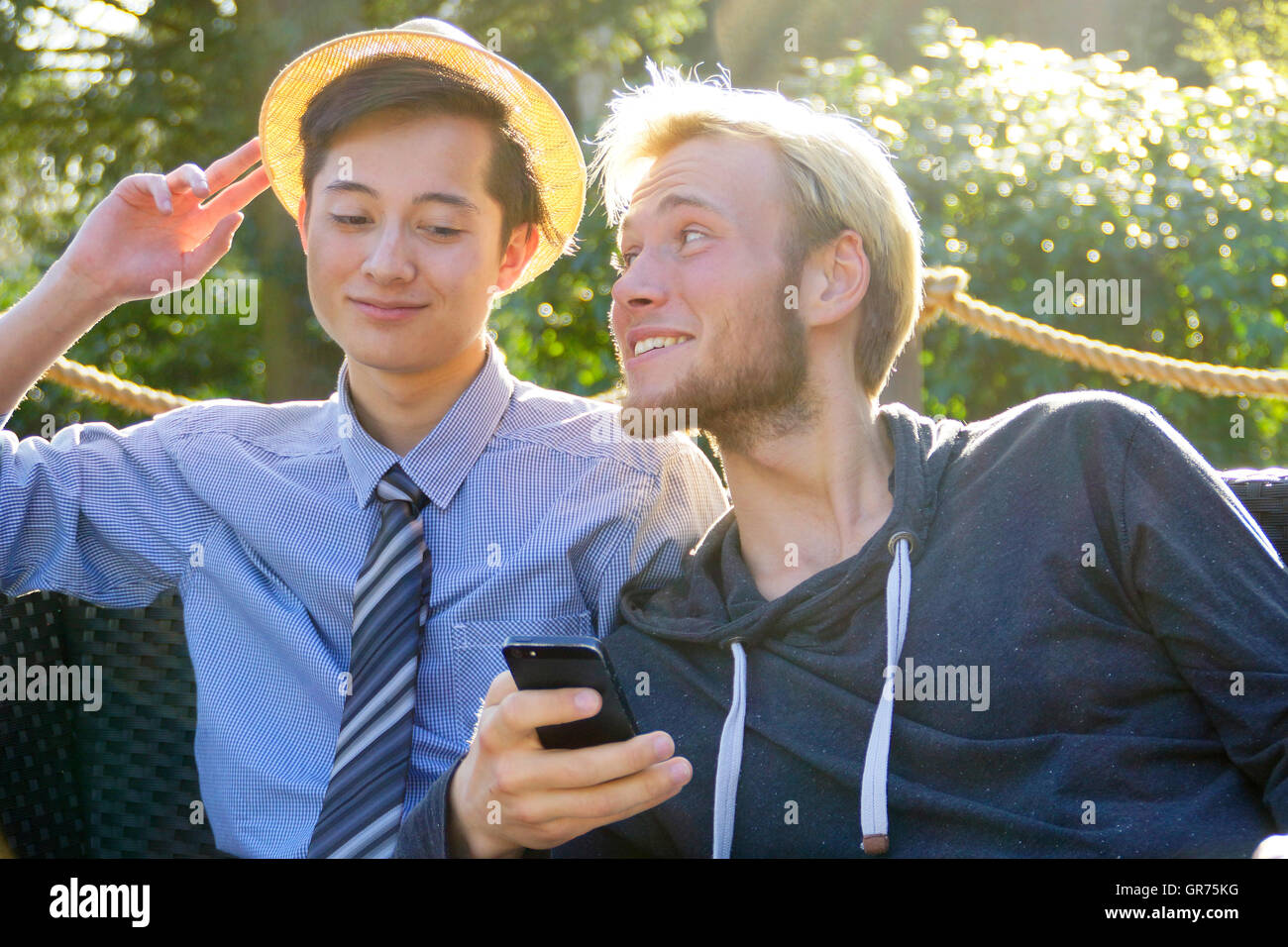 Two Friends With Smartphone Stock Photo - Alamy