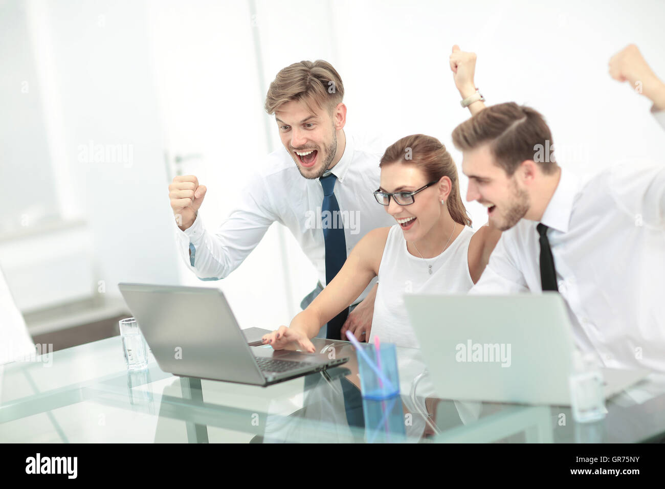 Business team celebrating a triumph with arms up Stock Photo - Alamy