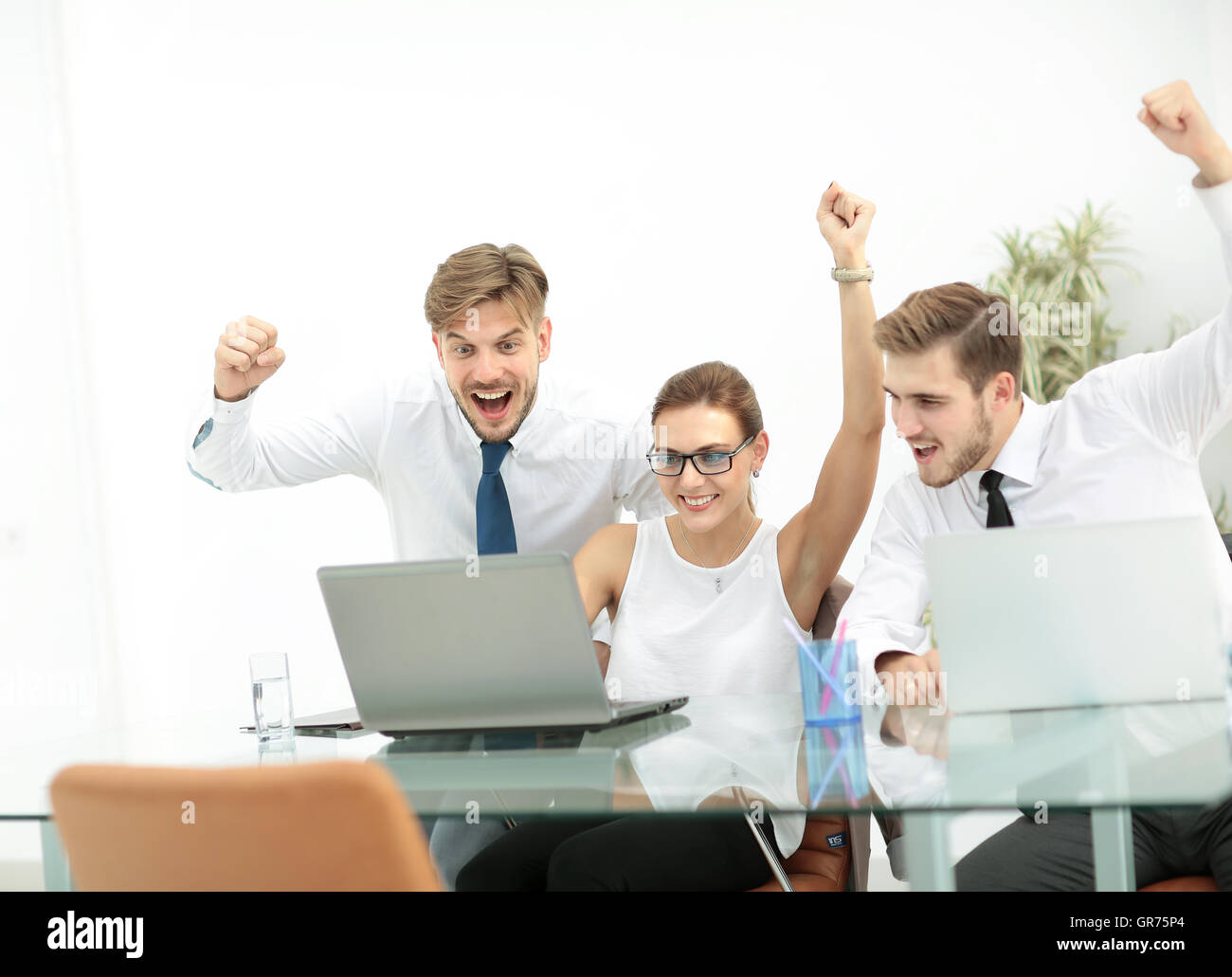 Business team celebrating a triumph with arms up Stock Photo - Alamy