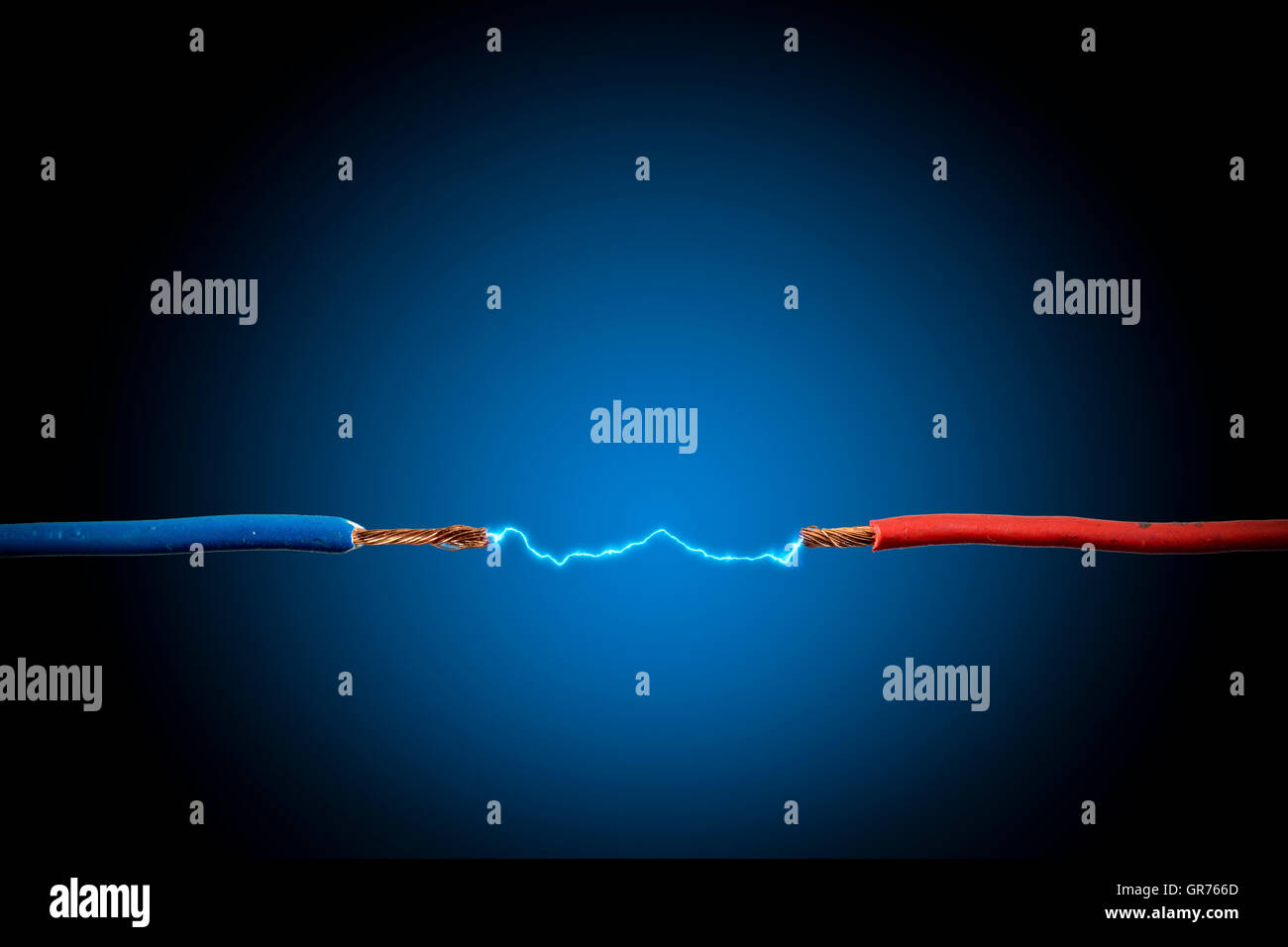 Two cables with spark Stock Photo - Alamy