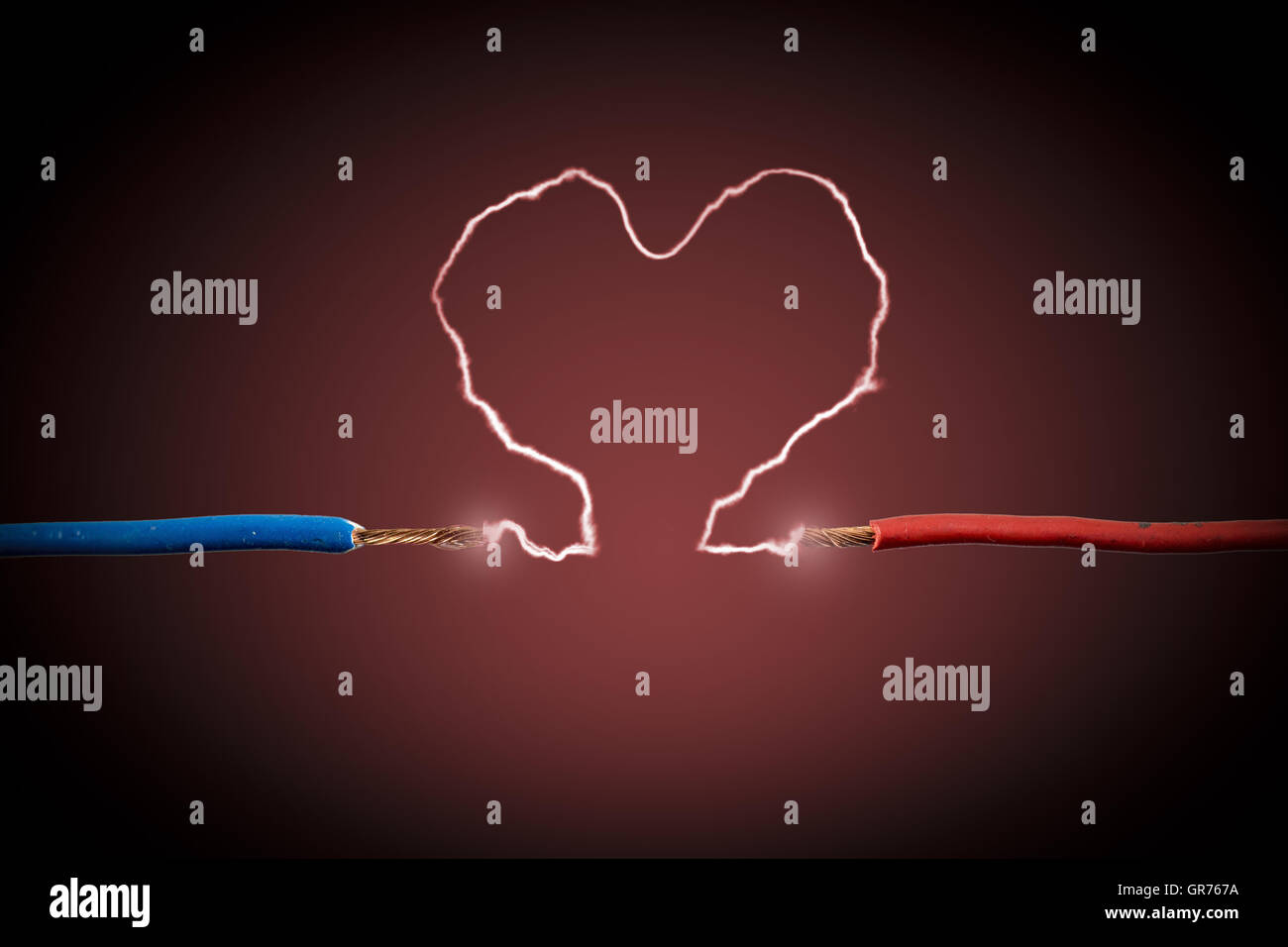 Two cables with heart Stock Photo - Alamy