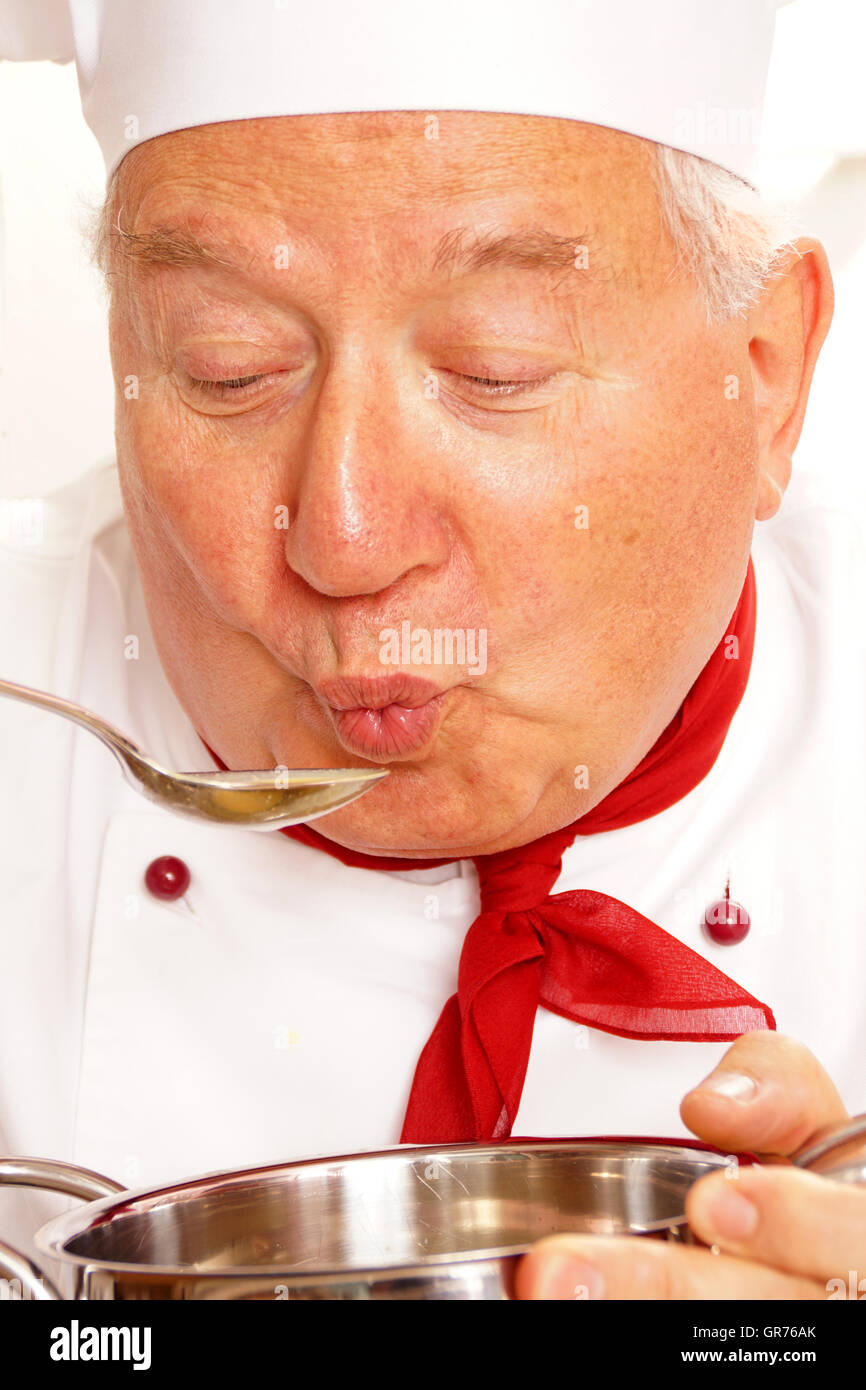 Cook Tasting The Food Stock Photo - Alamy