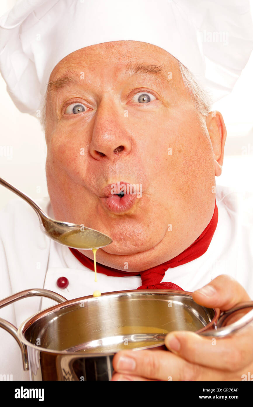 Cook Tasting The Food Stock Photo - Alamy