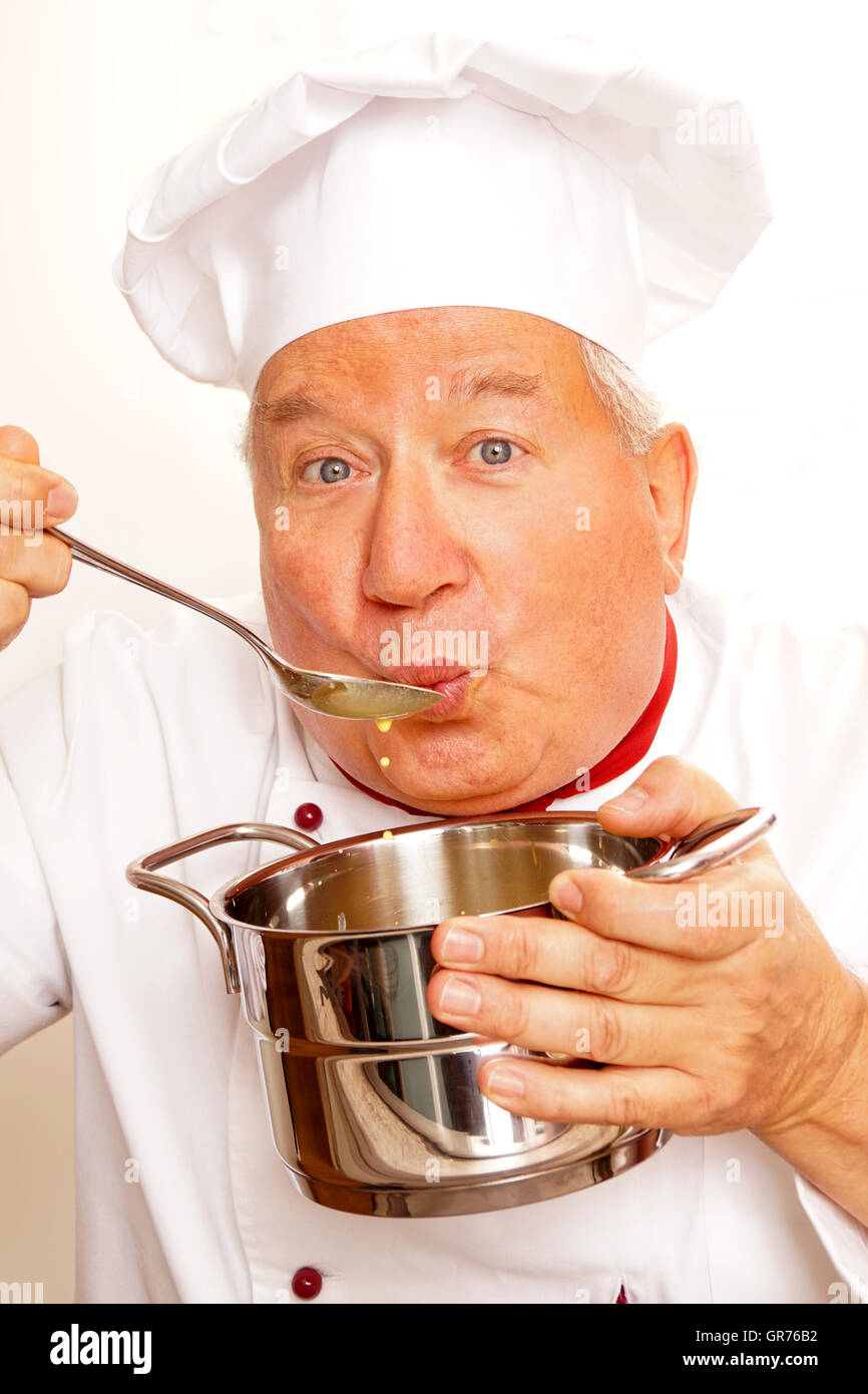 Cook Tasting The Food Stock Photo - Alamy