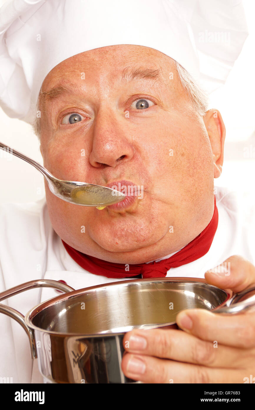 Cook Tasting The Food Stock Photo - Alamy