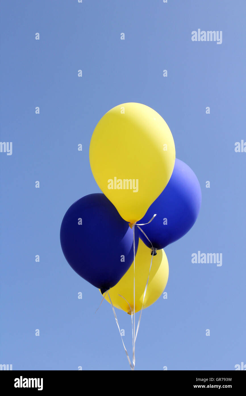 Blue and yellow balloons hi-res stock photography and images - Alamy