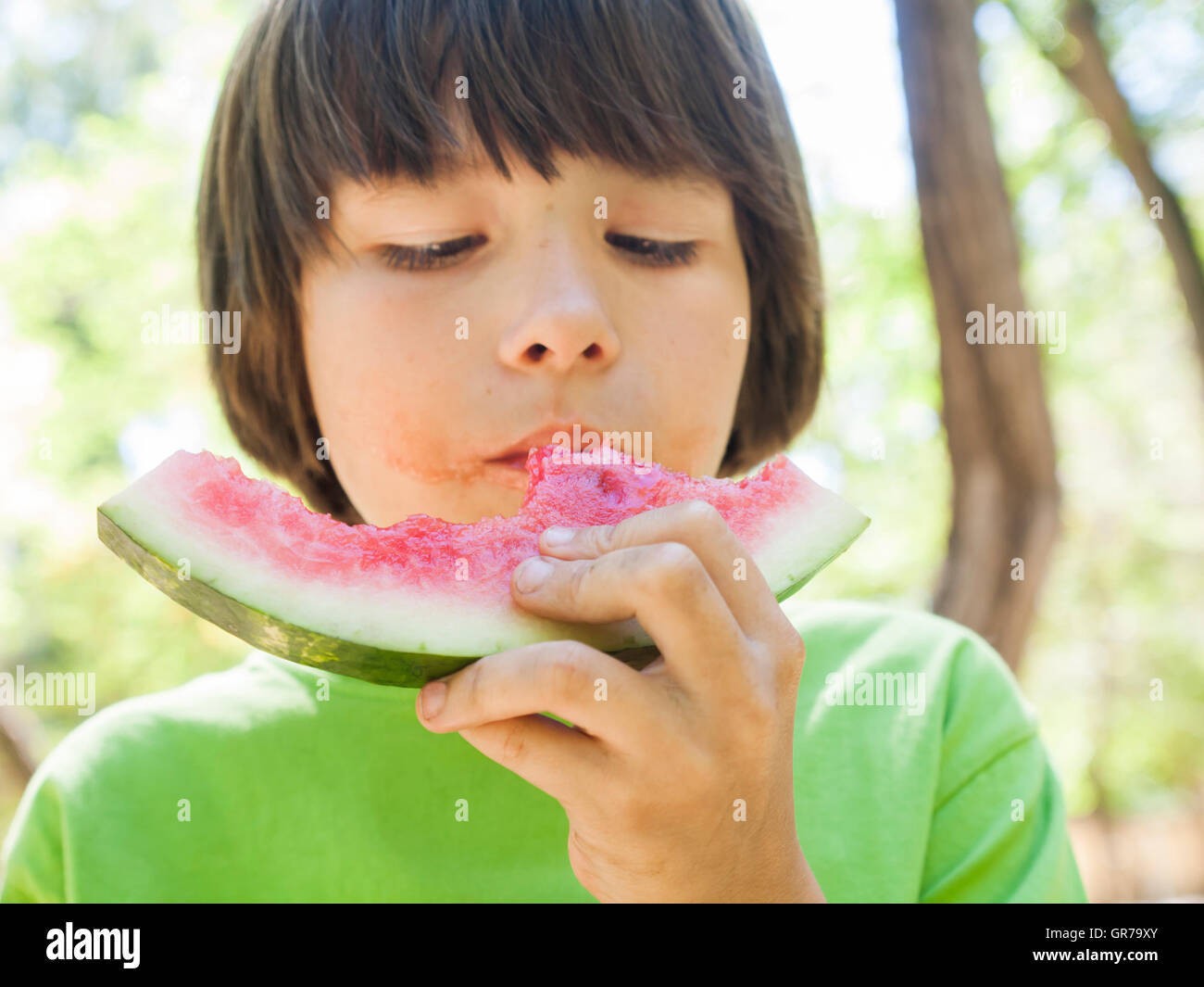Boy Child Eating Watermelon During Sunny Day Stock Photo - Alamy