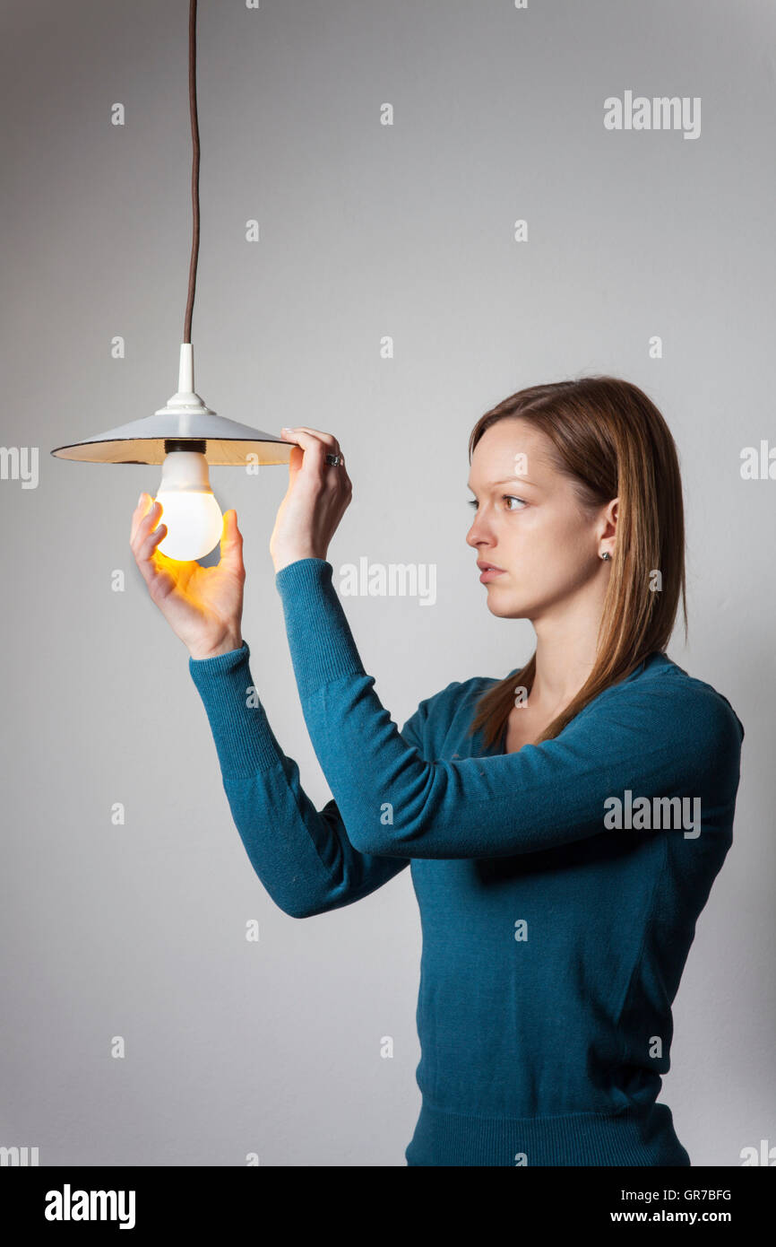 Girl holding led bulb hi-res stock photography and images - Alamy