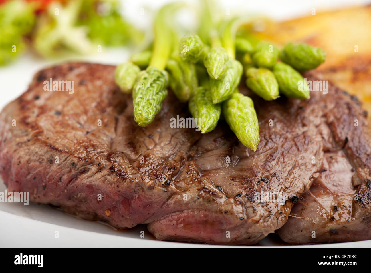Wild Asparagus On A Steak Stock Photo - Alamy