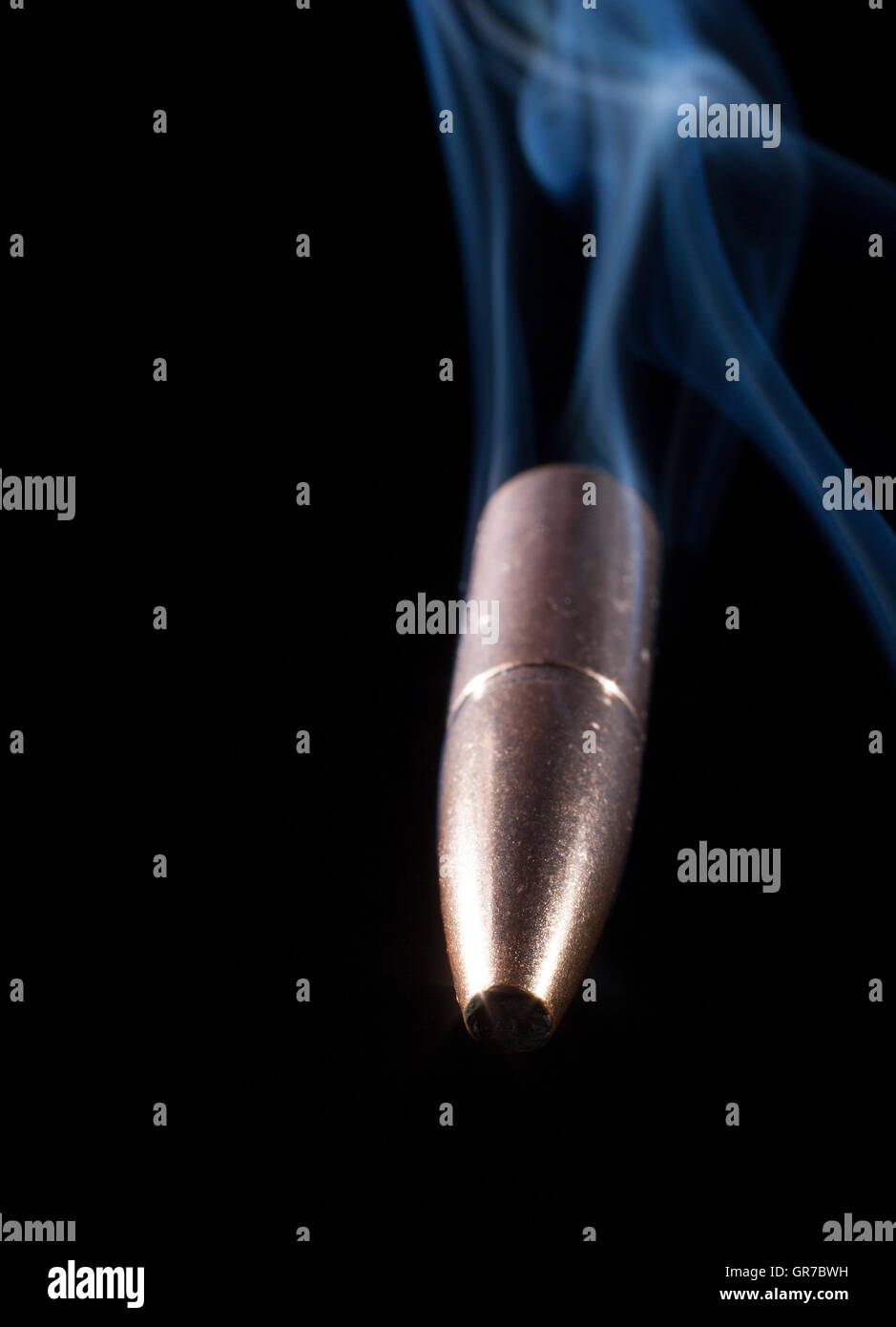 Copper bullet that looks like it is coming at the viewer Stock Photo ...