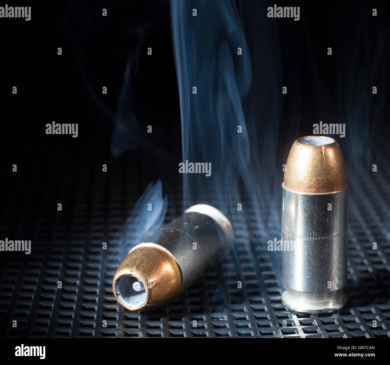 Handgun cartridges with hollow points and smoke Stock Photo - Alamy