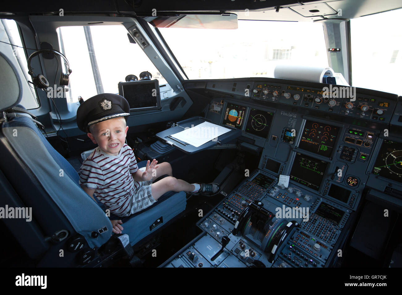 Young boys aged 5 and 2 visiting British Airways cockpit, whilst the ...
