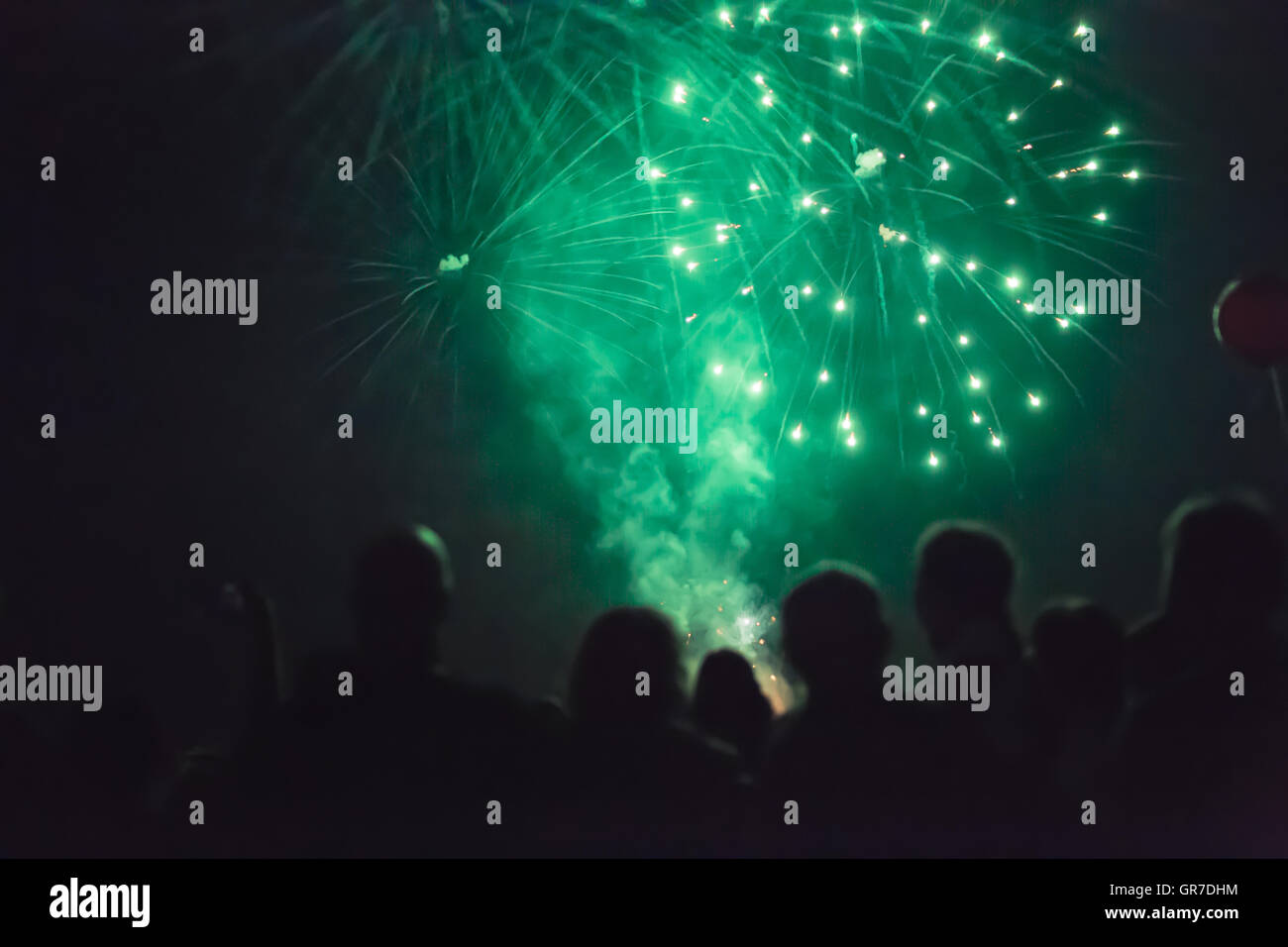Crowd watching fireworks and celebrating Stock Photo - Alamy