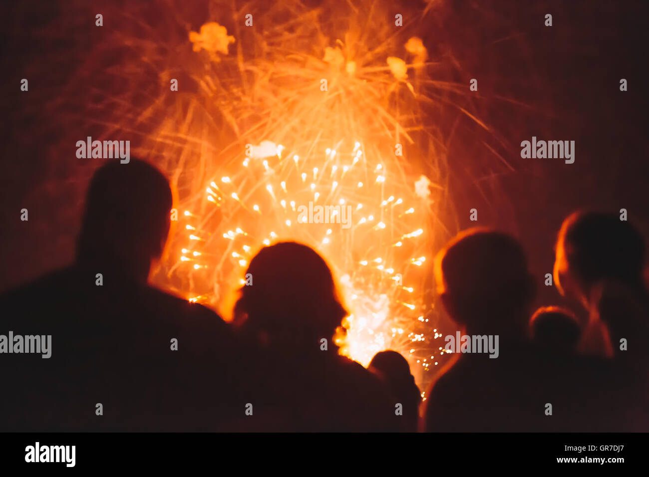 Happy people watching fireworks Stock Photo - Alamy