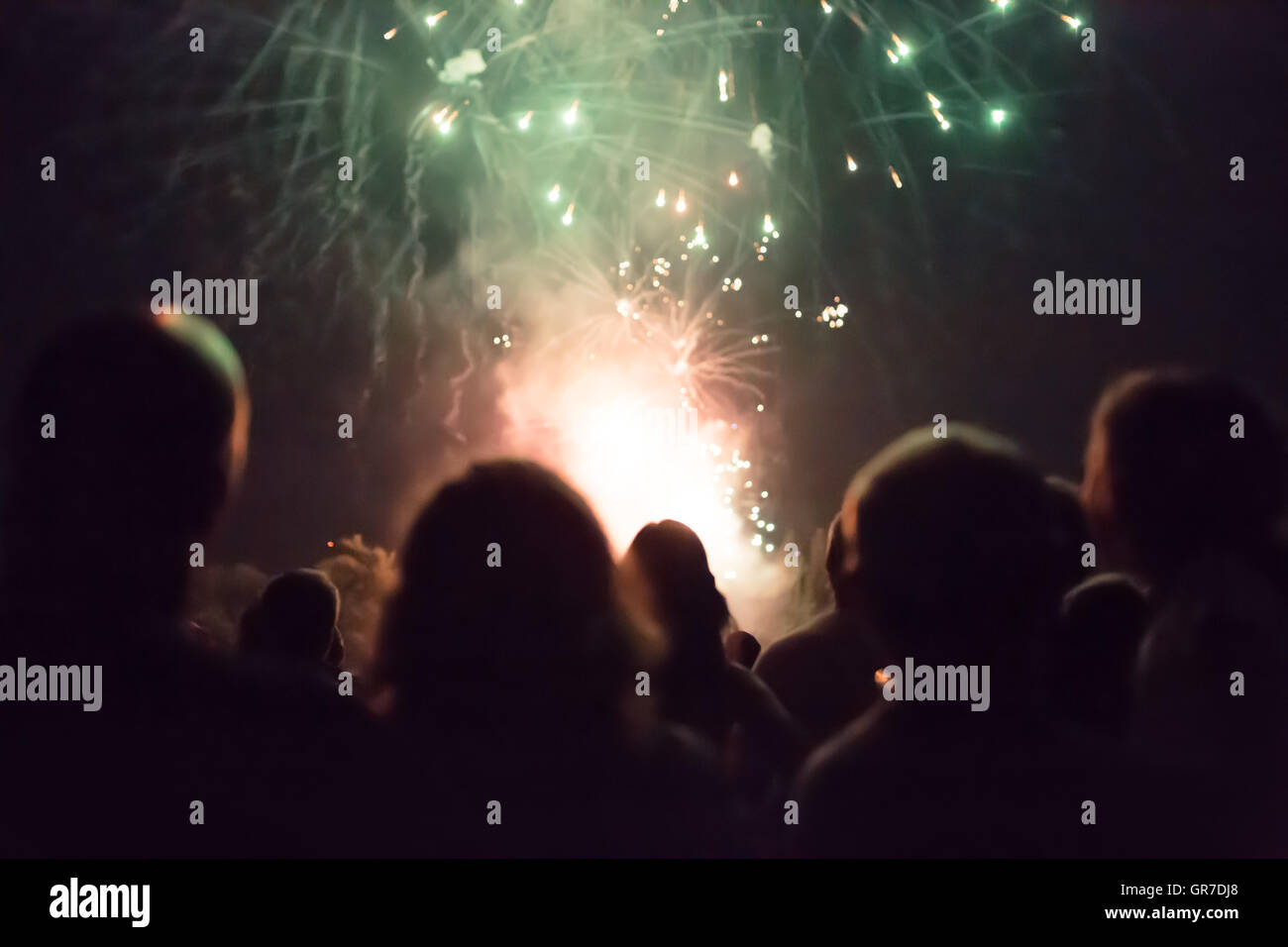 Crowd watching fireworks and celebrating Stock Photo - Alamy